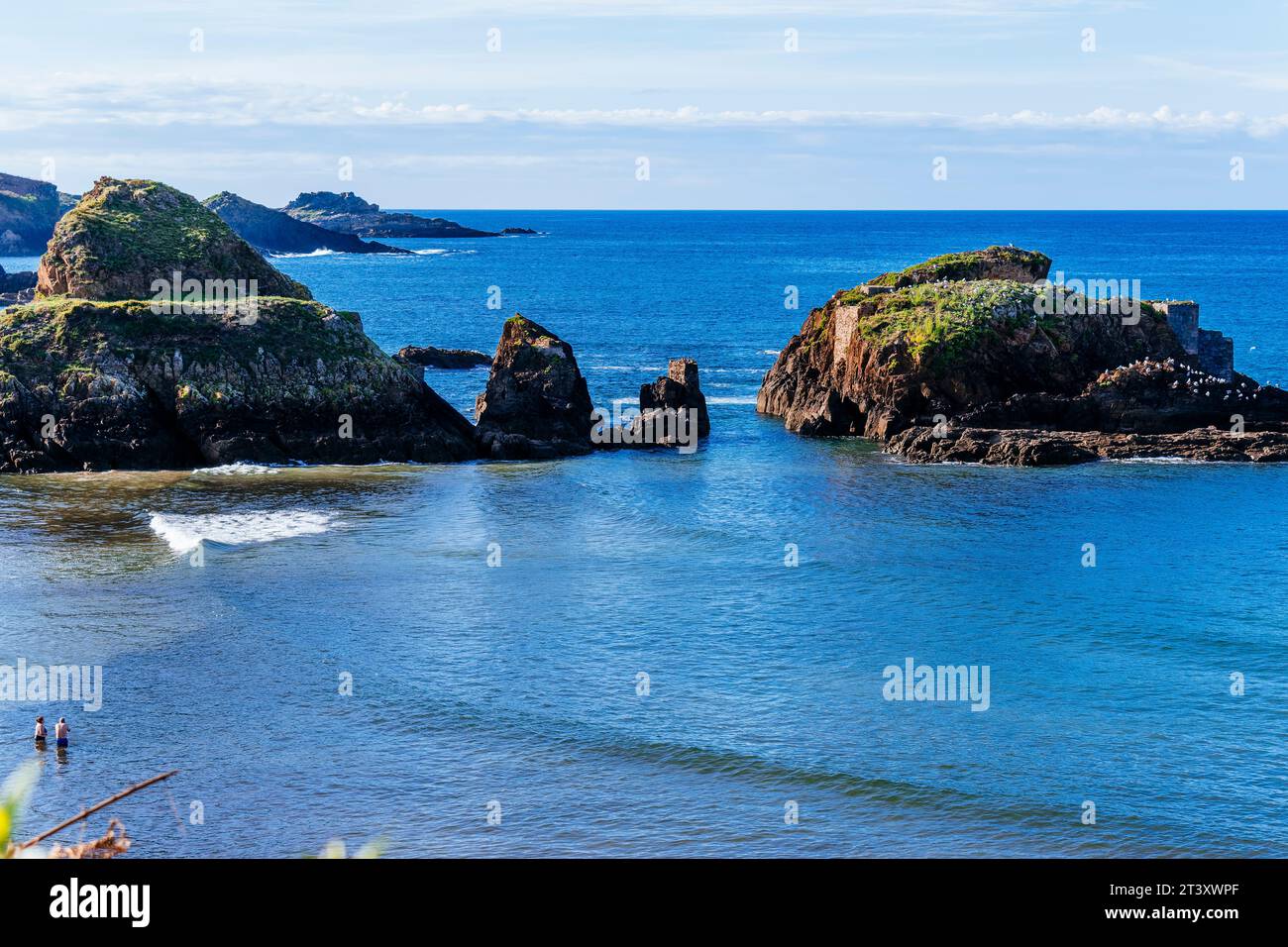 Remains of the old iron loading dock. Porcía beach is located in the ...