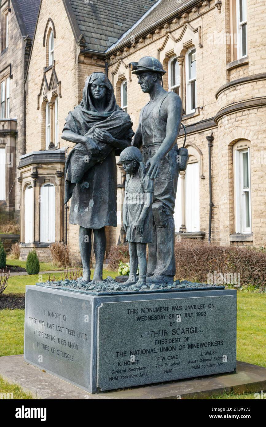 A statue of a miner and his family in front of the NUM building ...