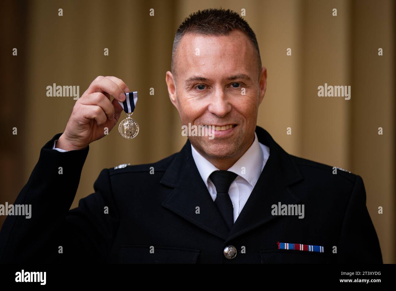 Detective Superintendent Neil Pudney after being decorated with the ...