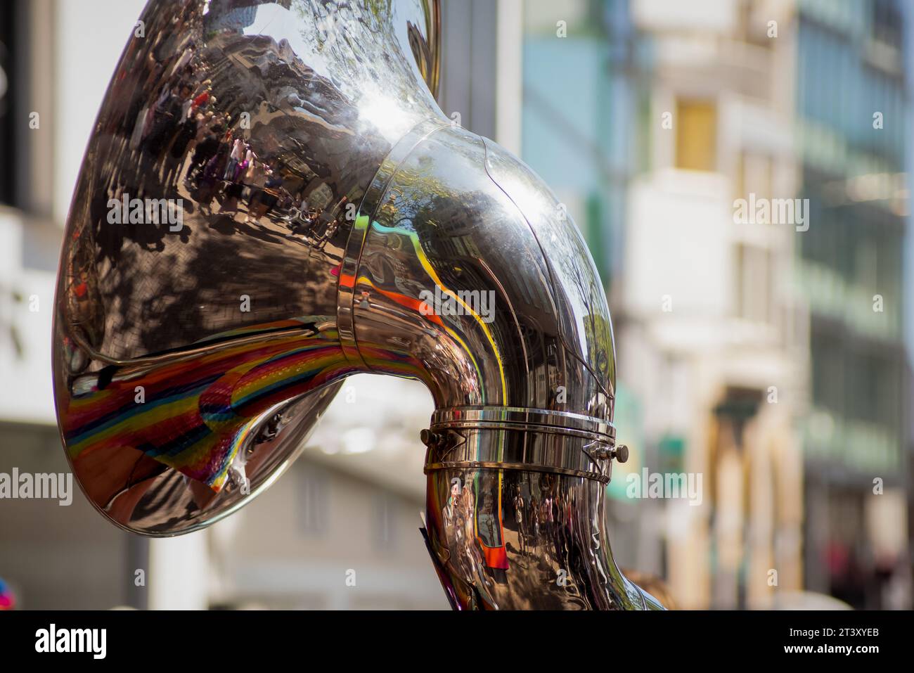 Top of the musical instrument tuba close-up with reflection of street ...