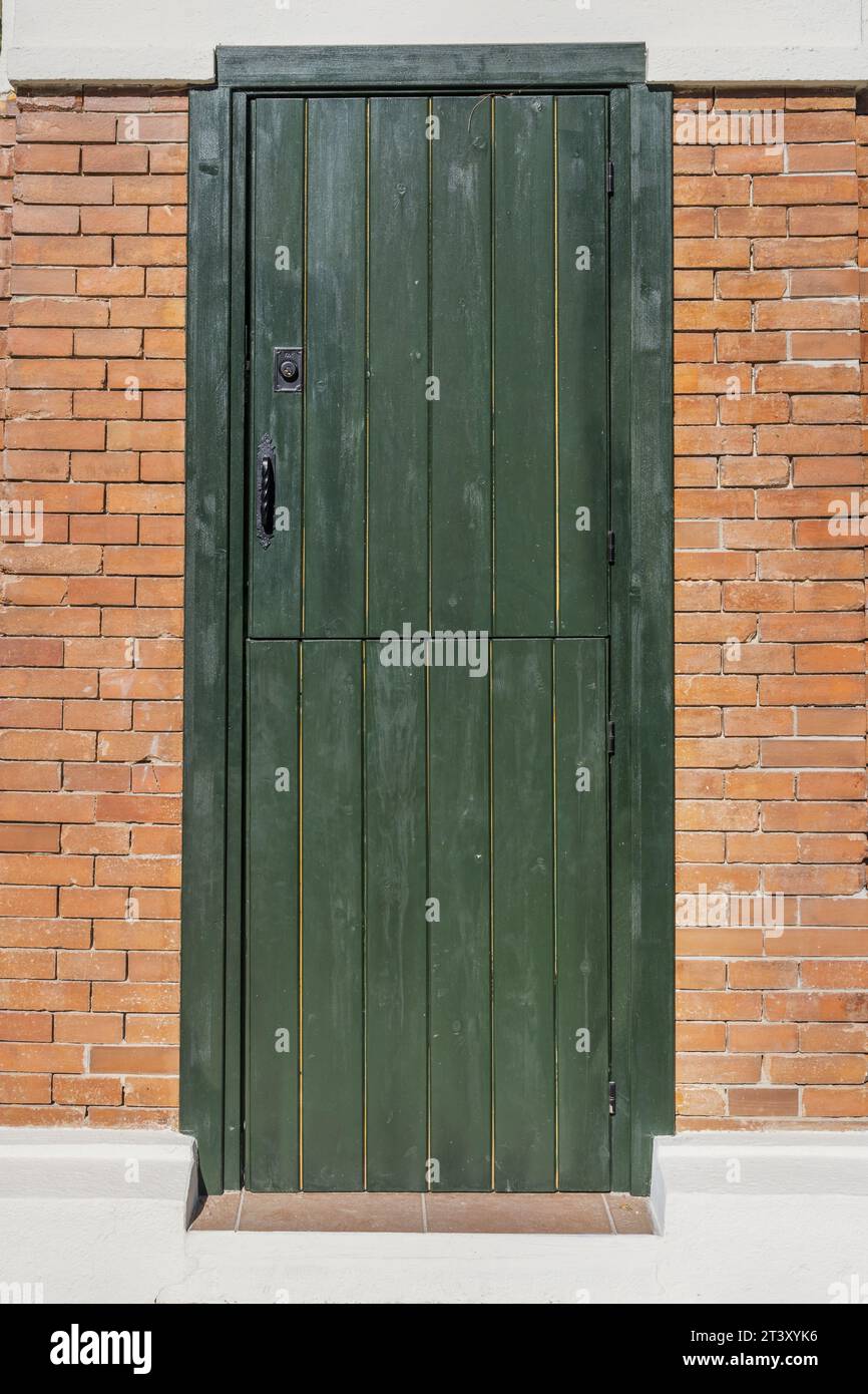 A green painted plank door cut in half Stock Photo - Alamy