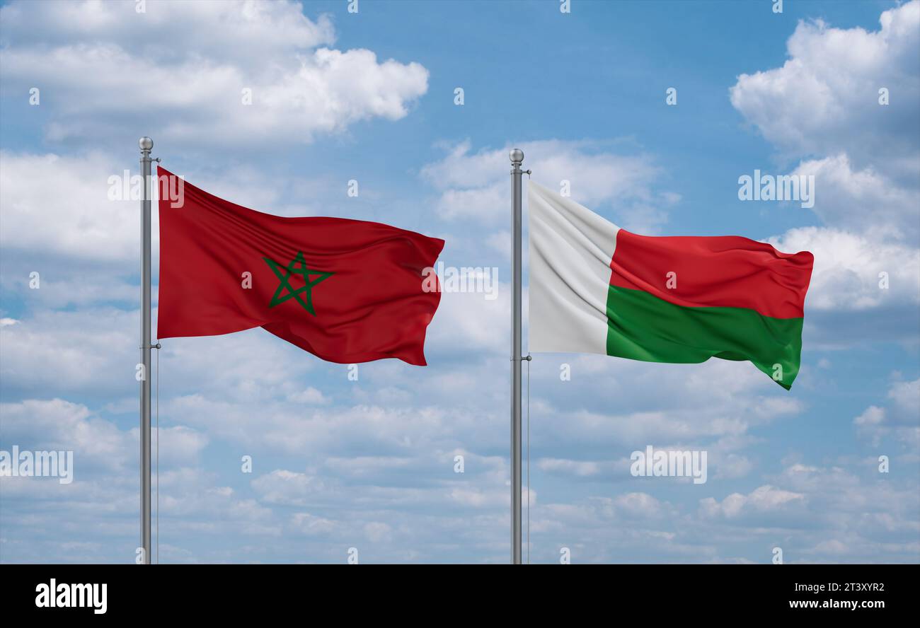 Madagascar and Morocco flags waving together on blue cloudy sky, two ...