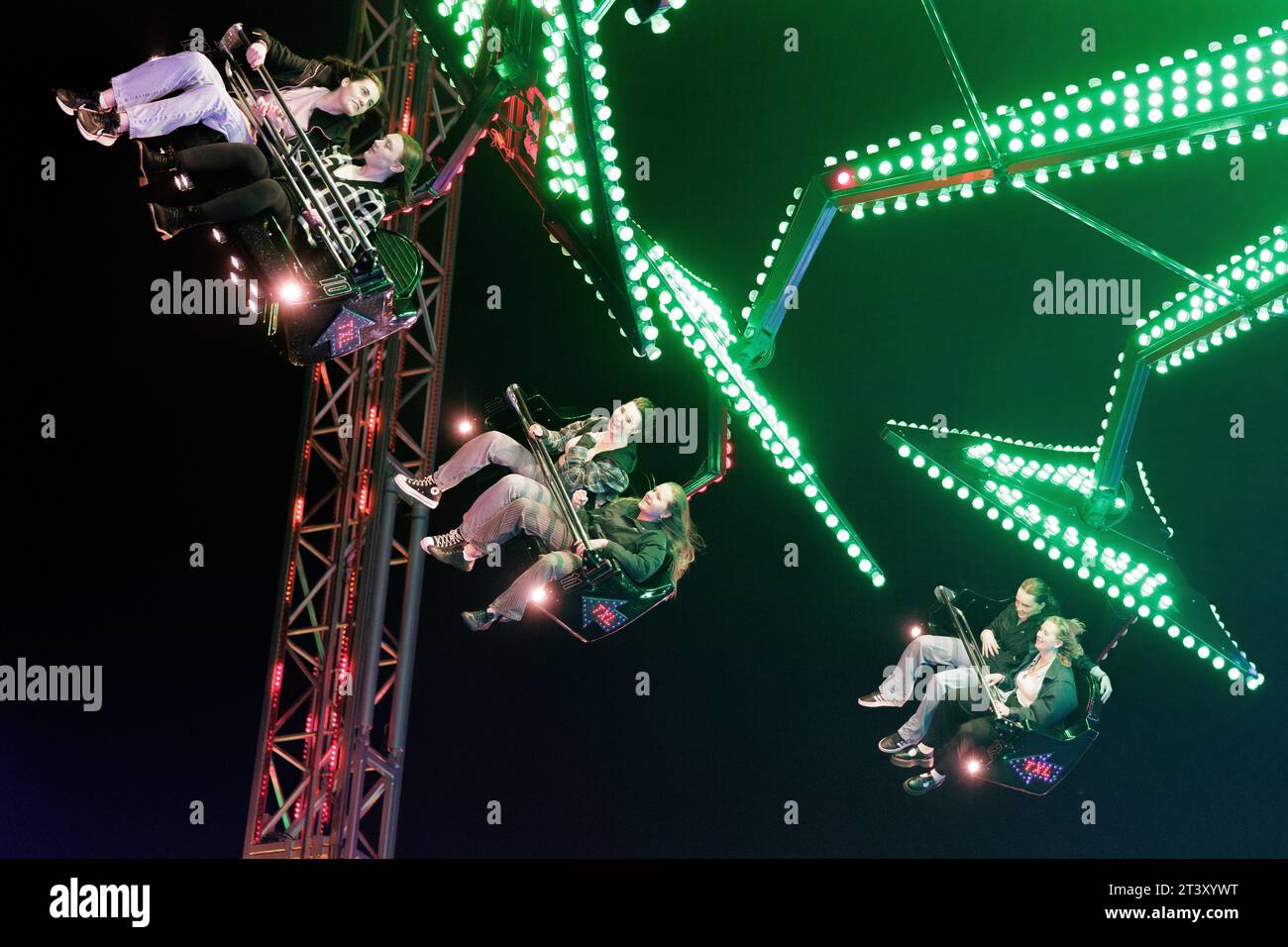 People enjoying a fairground ride at night, the Stratford upon Avon Mop ...