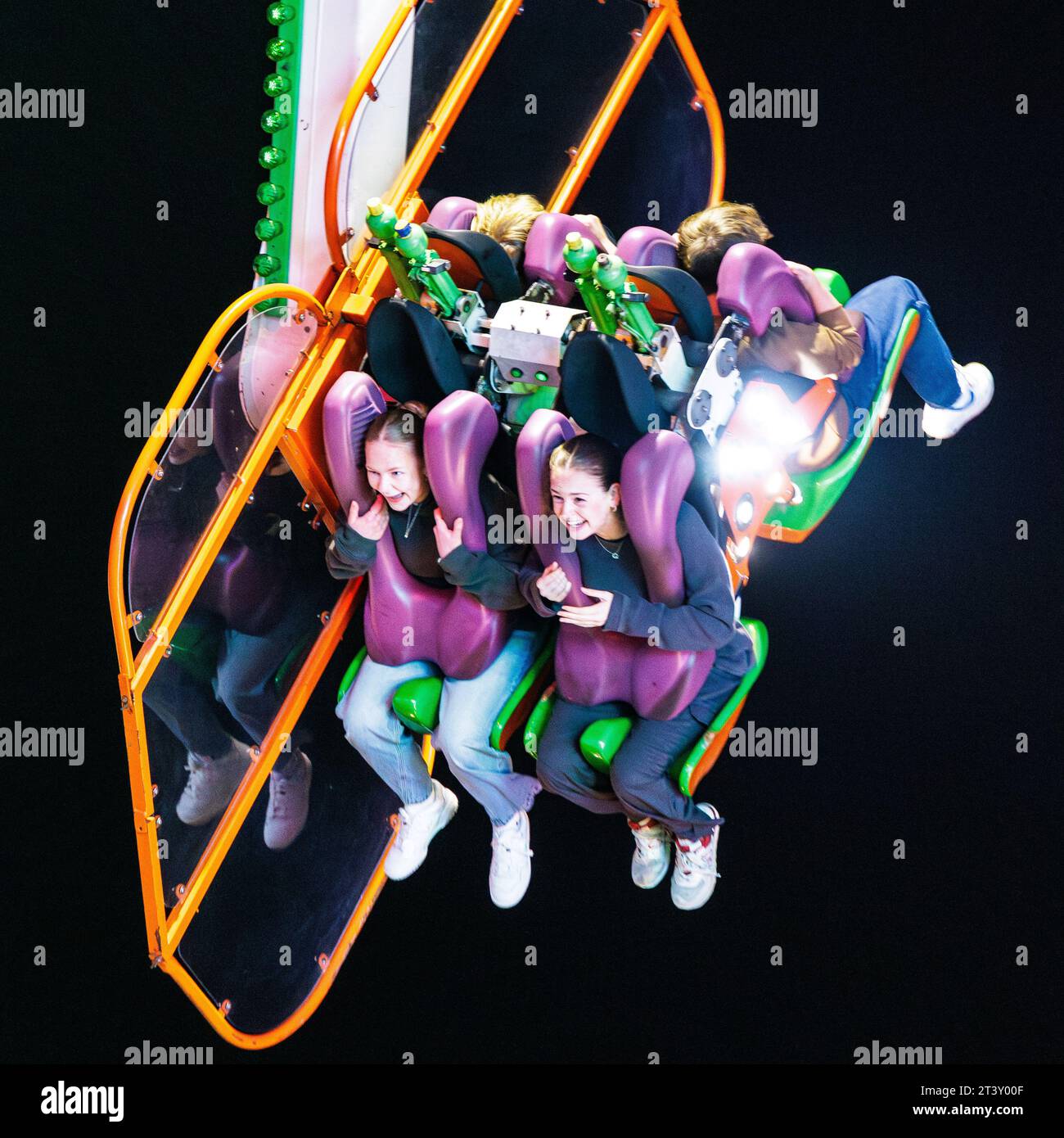 People enjoying a fairground ride at night, the Stratford upon Avon Mop ...