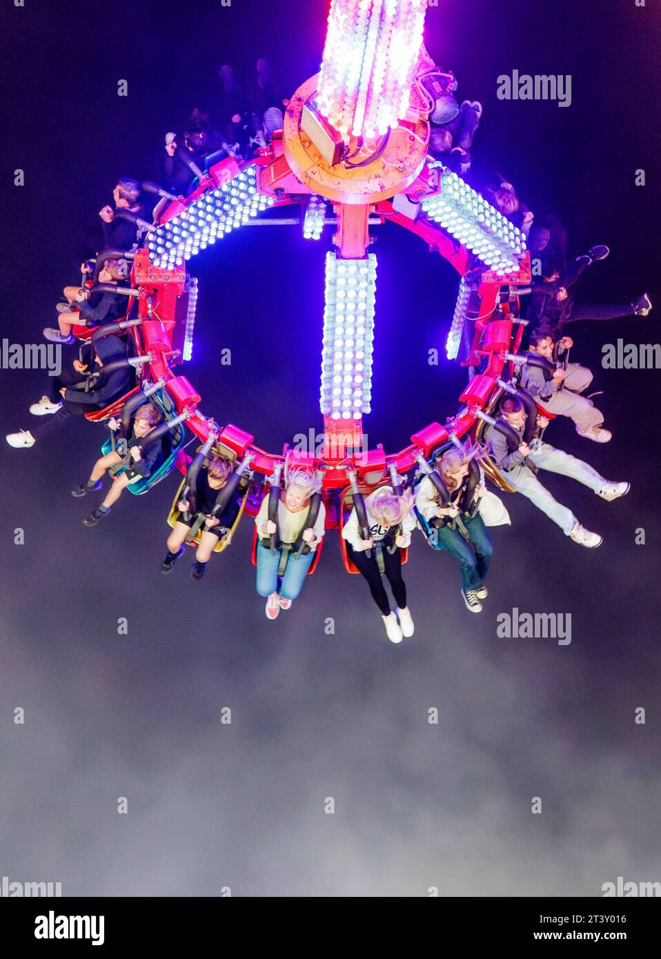 People enjoying a fairground ride at night, the Stratford upon Avon Mop ...