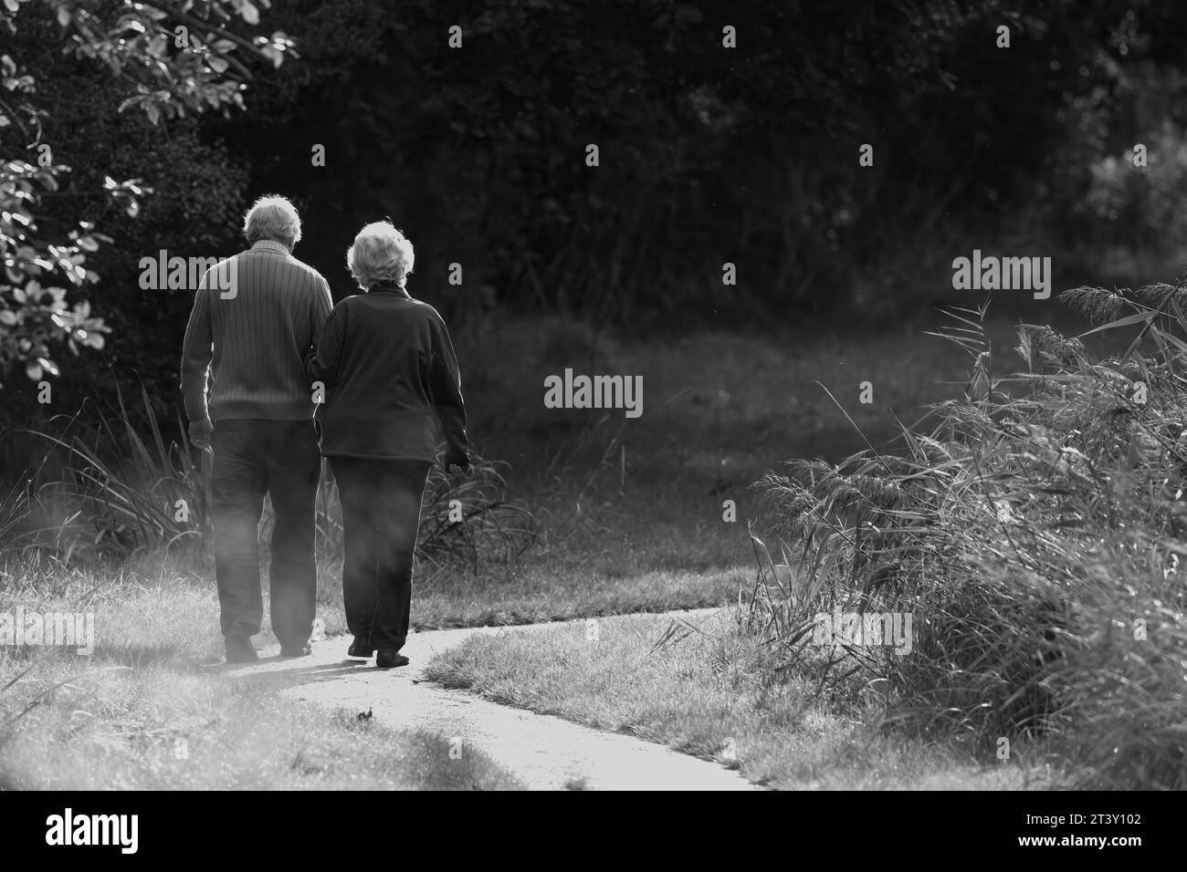 A couple going for an afternoon walk Stock Photo - Alamy