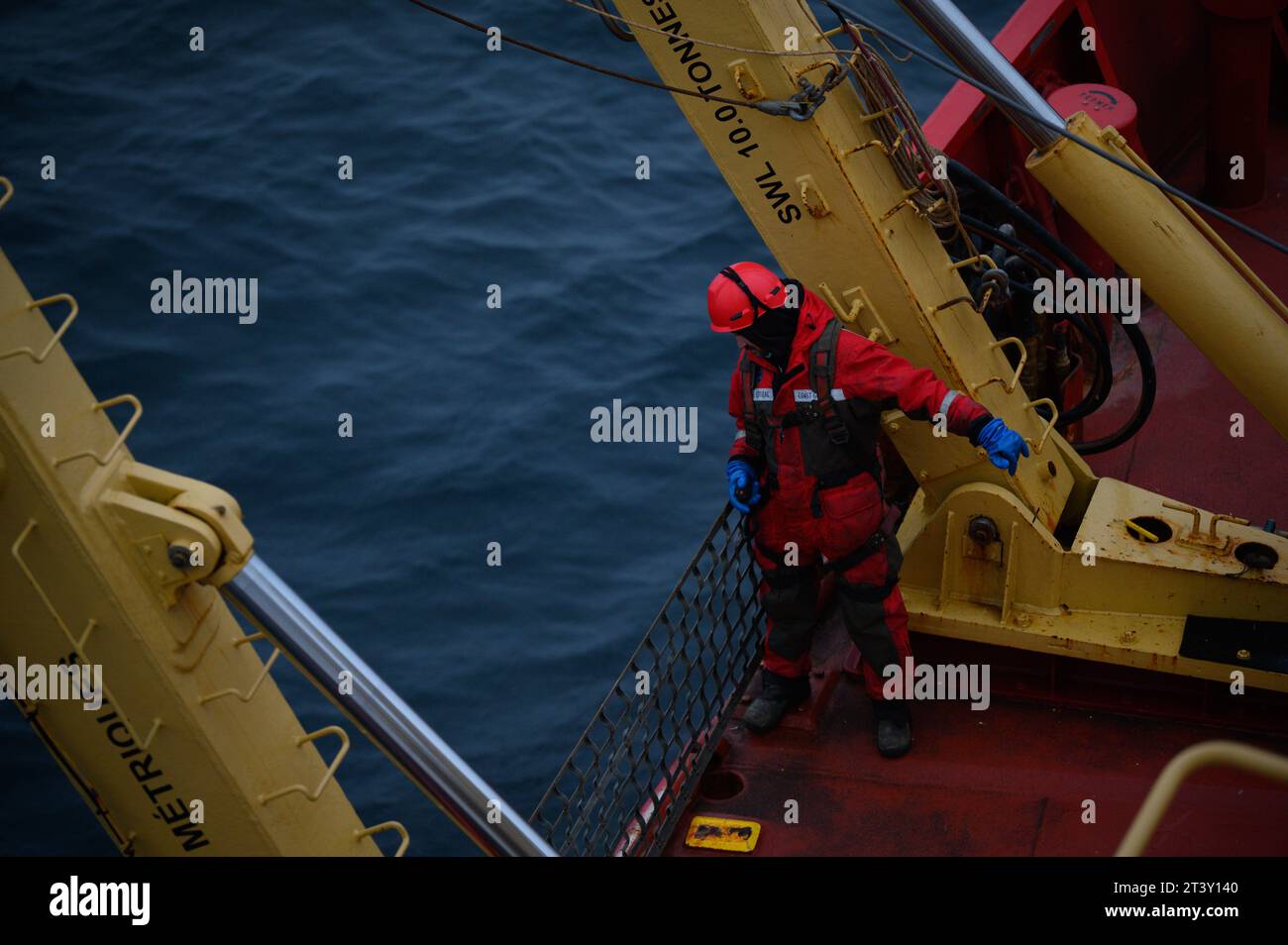 Canada. 18th Oct, 2023. A Coast Guard crew member peers over the side ...