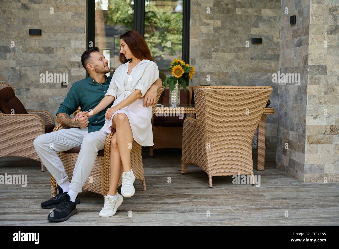 Couple sits on chair hi-res stock photography and images - Alamy