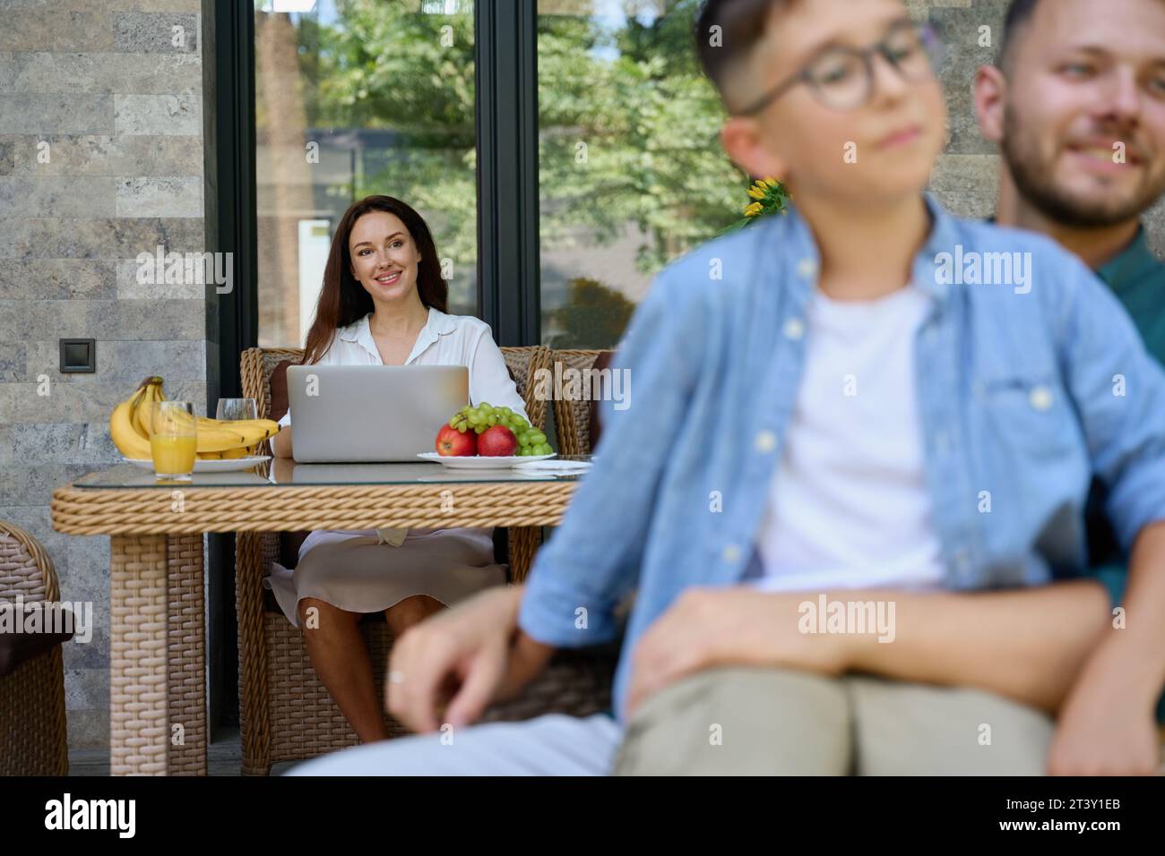 Boy sits on the lap of a happy father Stock Photo - Alamy