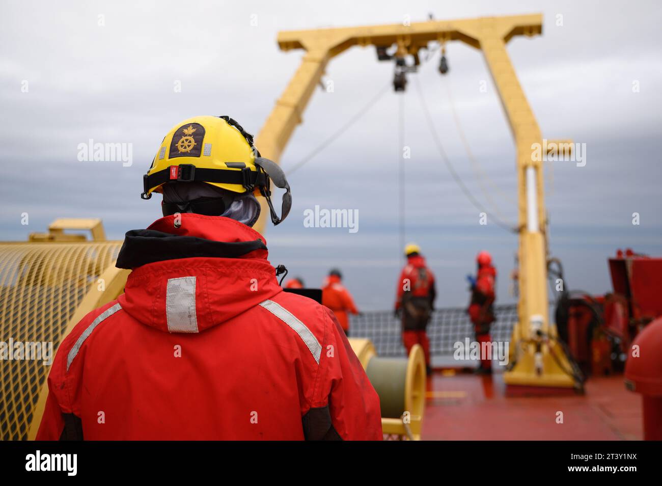 Canada. 18th Oct, 2023. Coast Guard crew members deploy a net in the ...