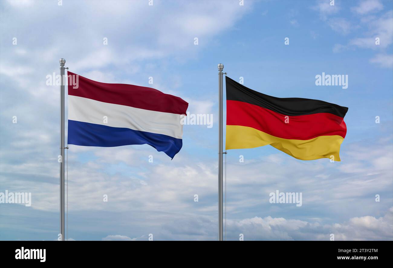Germany and Netherlands flags waving together on blue cloudy sky, two ...