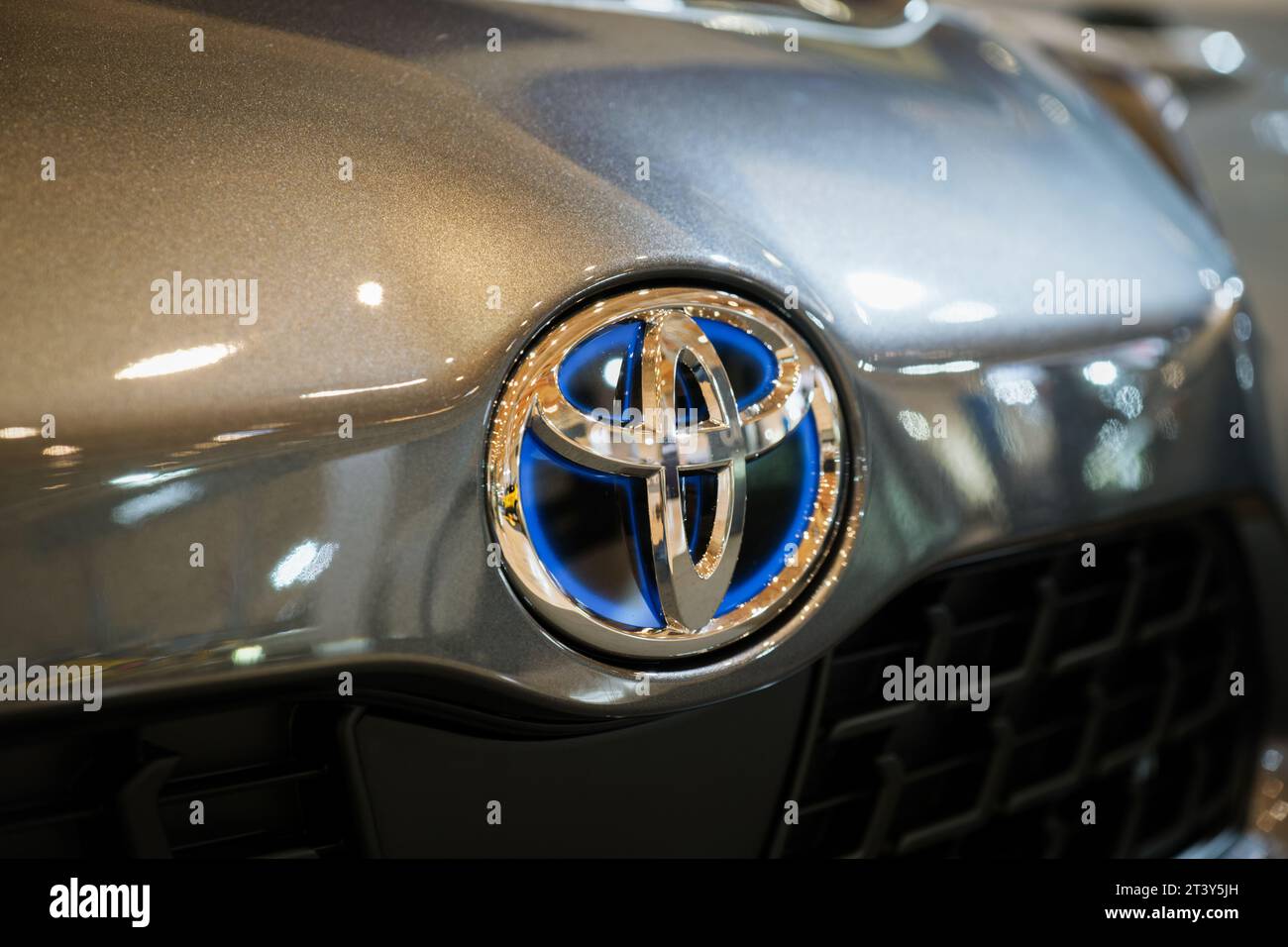 Toyota electric car logo emblem close up Stock Photo - Alamy