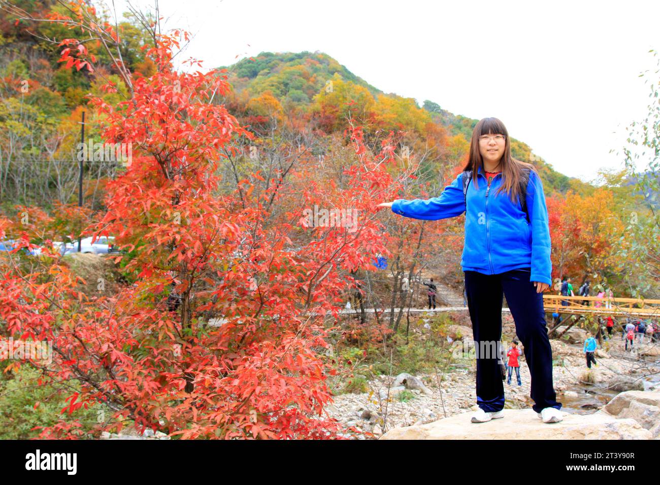BENXI - OCTOBER 4: Female tourist poses for photos in a scenic area on ...