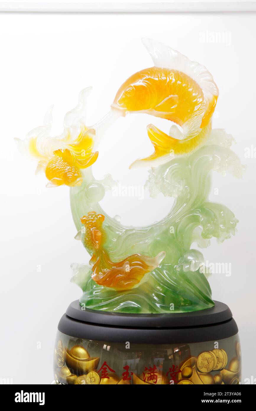Goldfish jade carvings in a shop, closeup of photo Stock Photo - Alamy