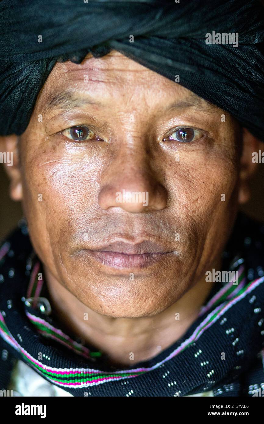 Portrait of a man from Adi tribe in his traditional clothes and ...