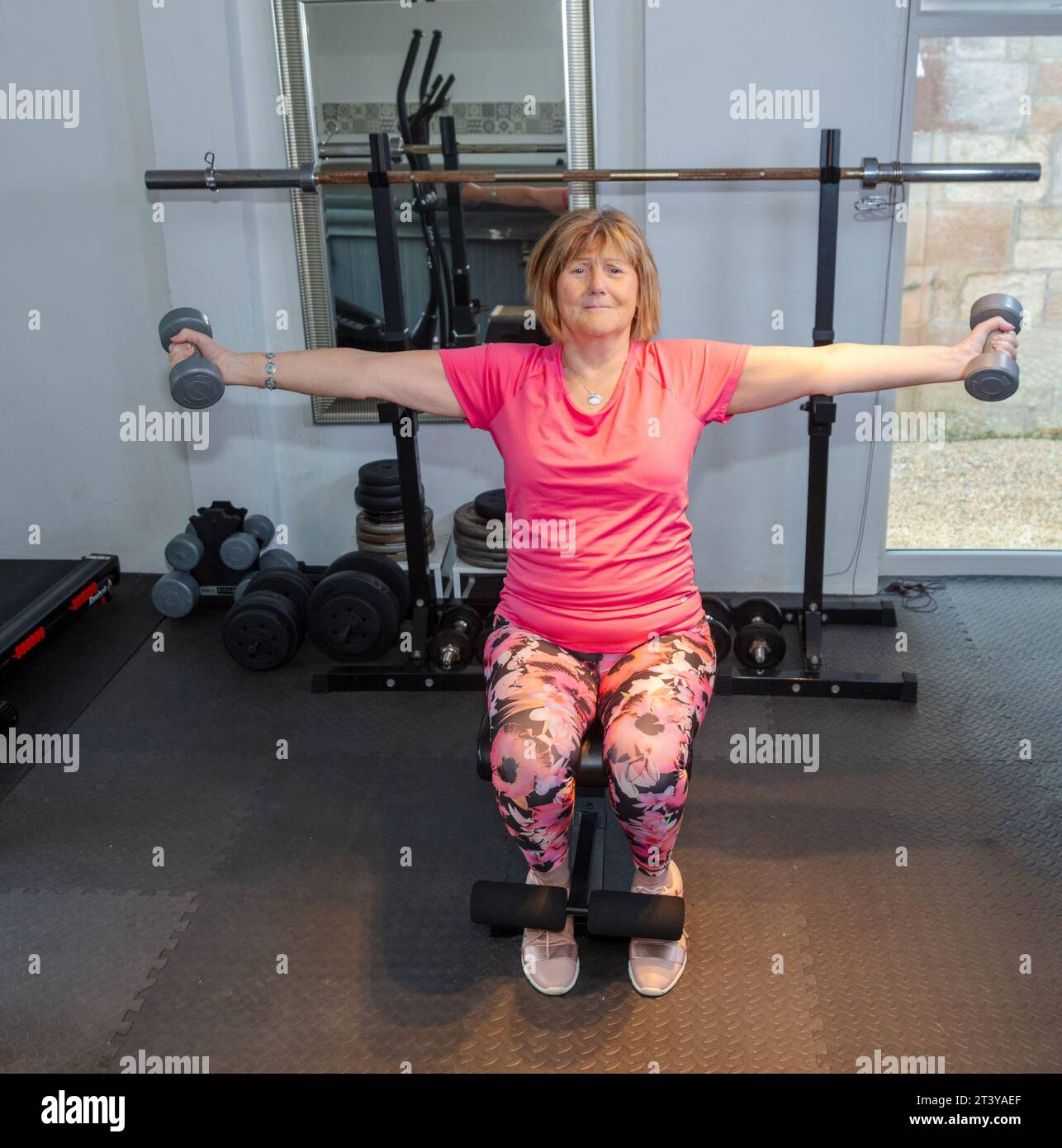 Fit active senior lady working out at the gym hi-res stock photography ...