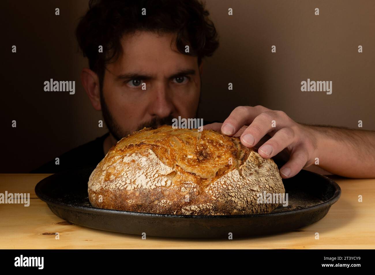 Attractive Young Caucasian Chef Posing With White Sourdough Bread The Sourdough Bread Is The