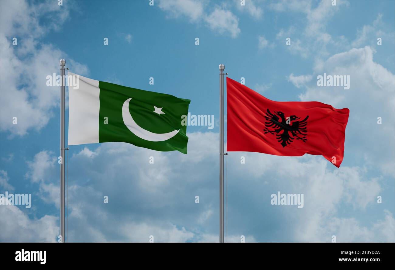 Pakistan and Albania flags waving together in the wind on blue cloudy ...