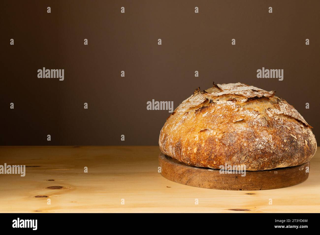 Healthy and very crunchy sourdough bread resting on a board Stock Photo ...