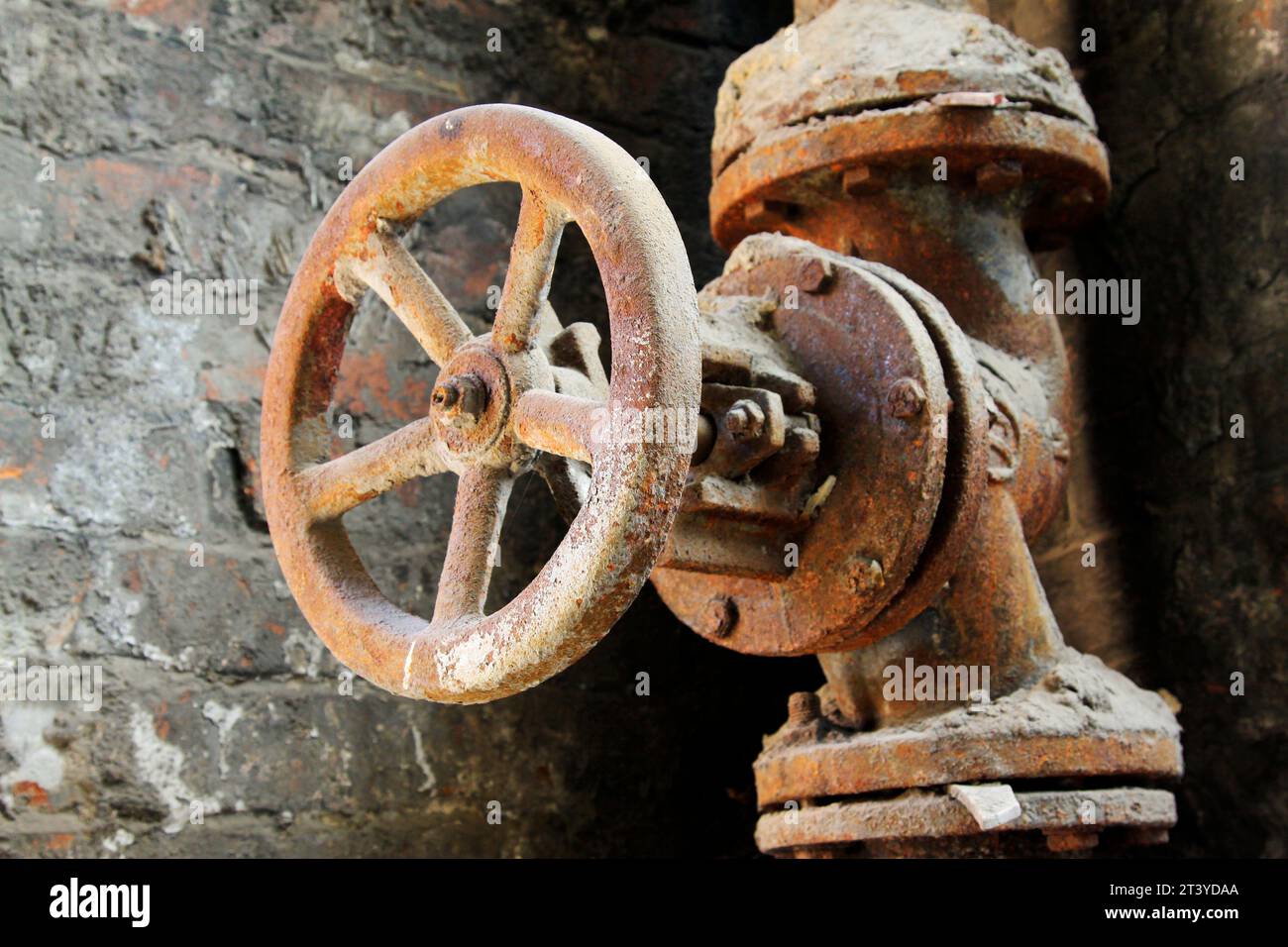 abandoned dirty pipe valve in a factory Stock Photo - Alamy