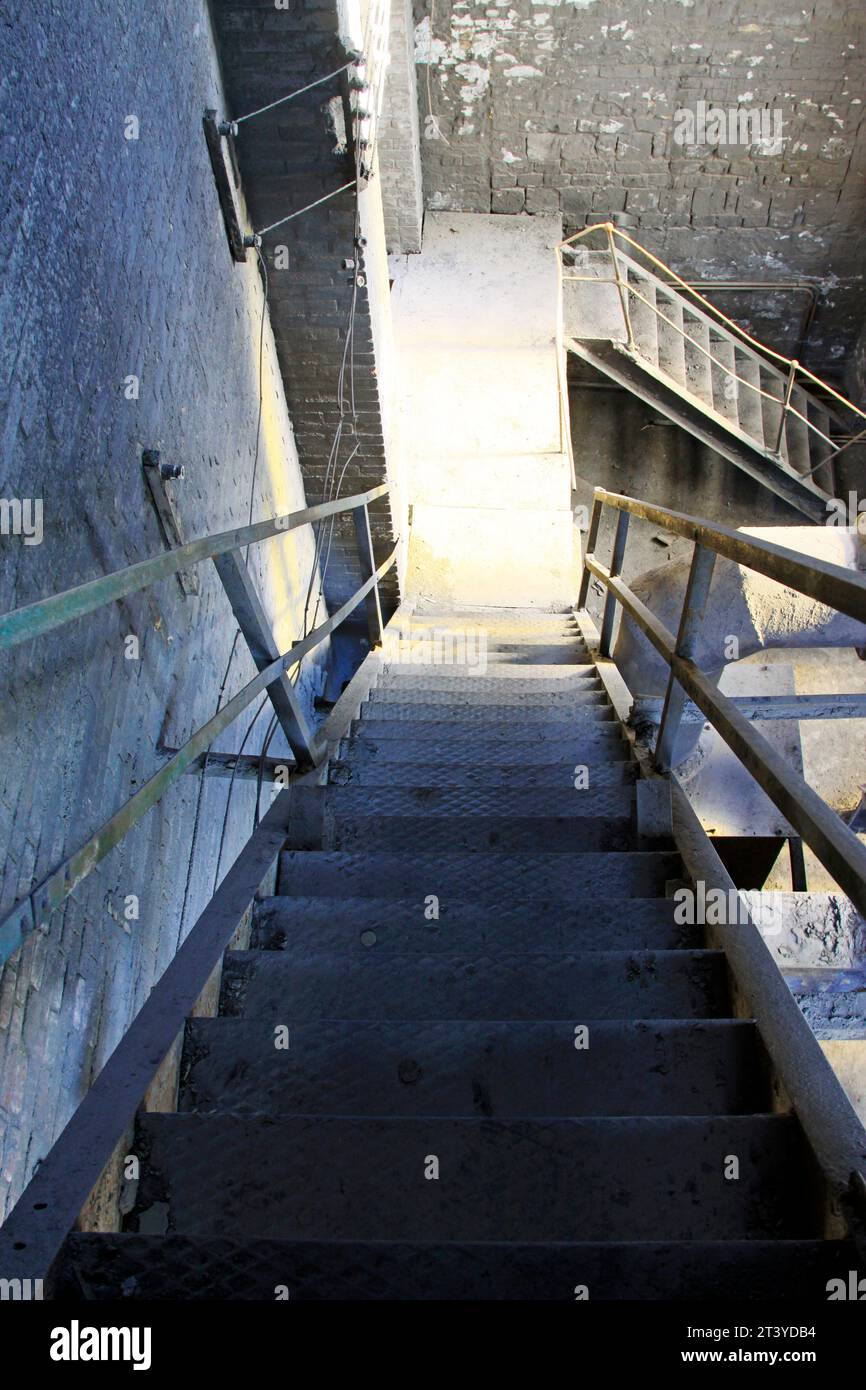 Steel stairs in an abandoned factory, closeup of photo Stock Photo - Alamy