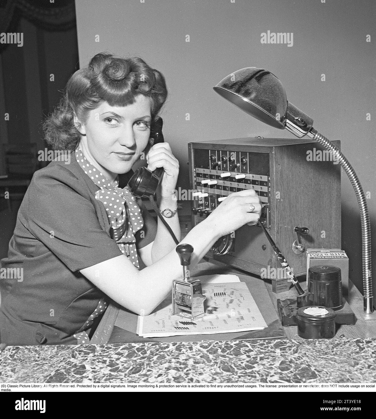 A young movie star-like woman works in the company's telephone exchange ...