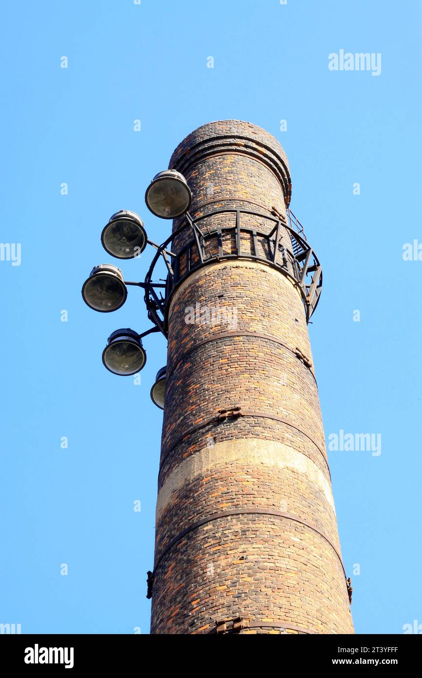 big chimney equipped with shoot lights in a factory Stock Photo - Alamy