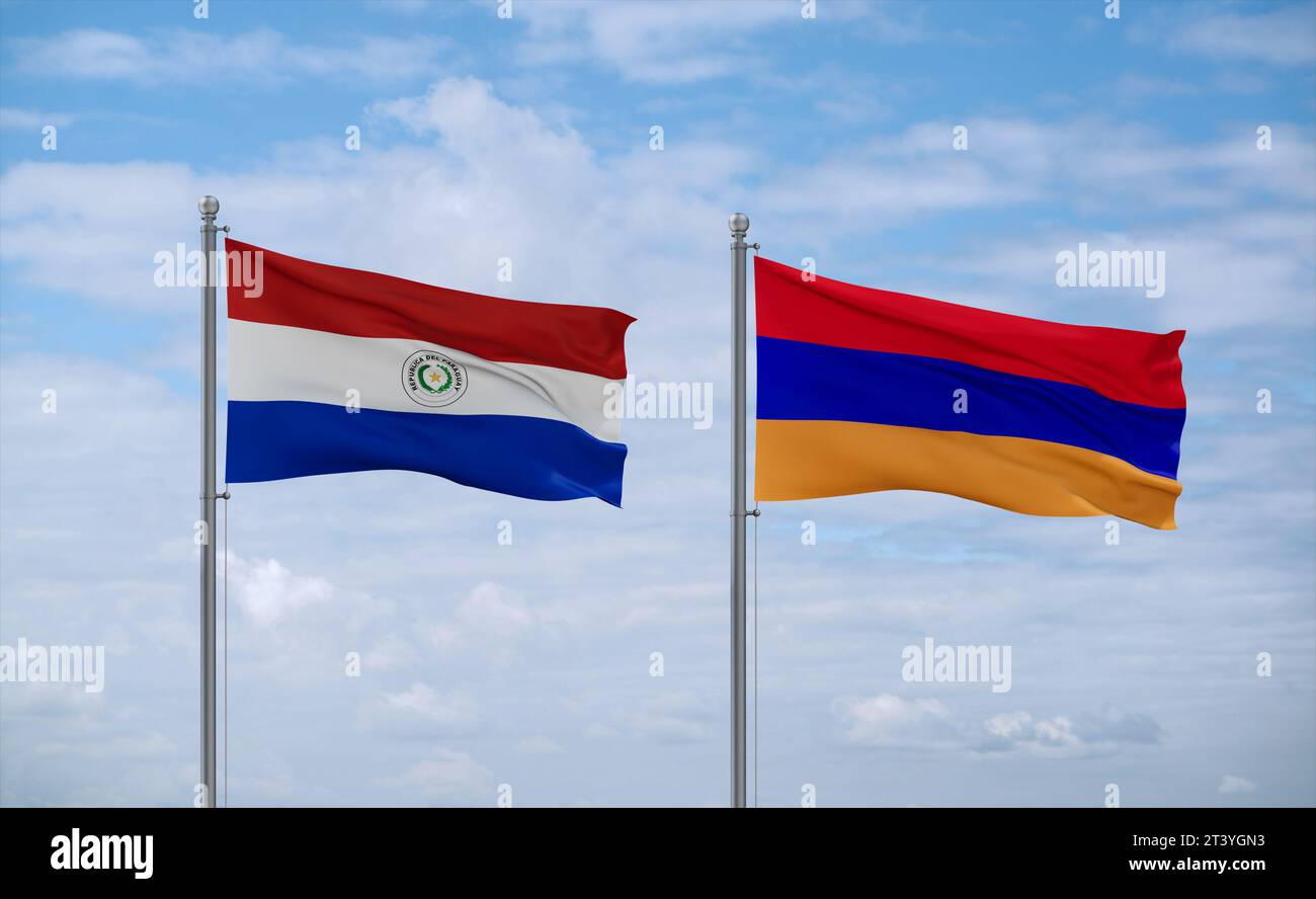 Armenia and Paraguay flags waving together in the wind on blue cloudy ...