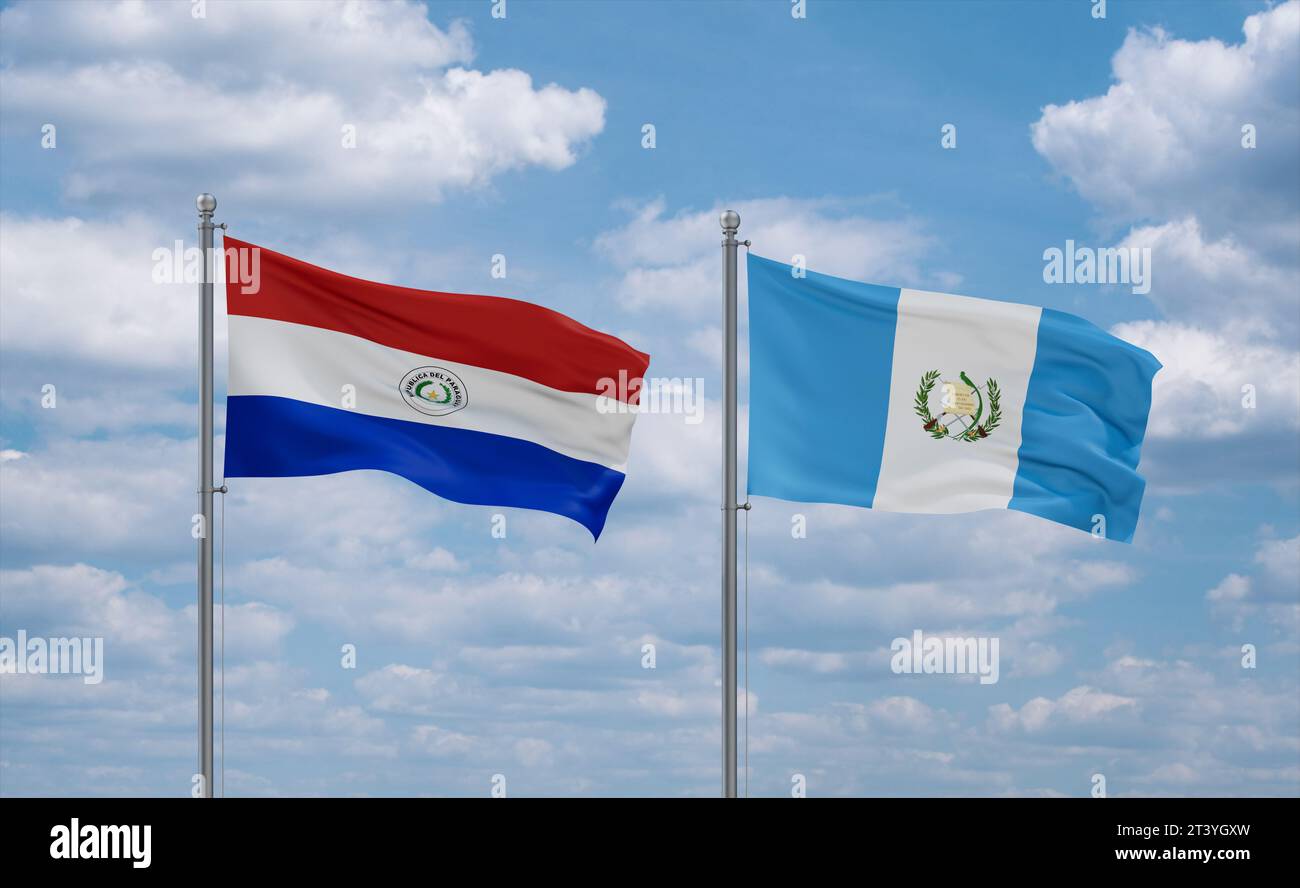 Guatemala and Paraguay flags waving together on blue cloudy sky, two ...