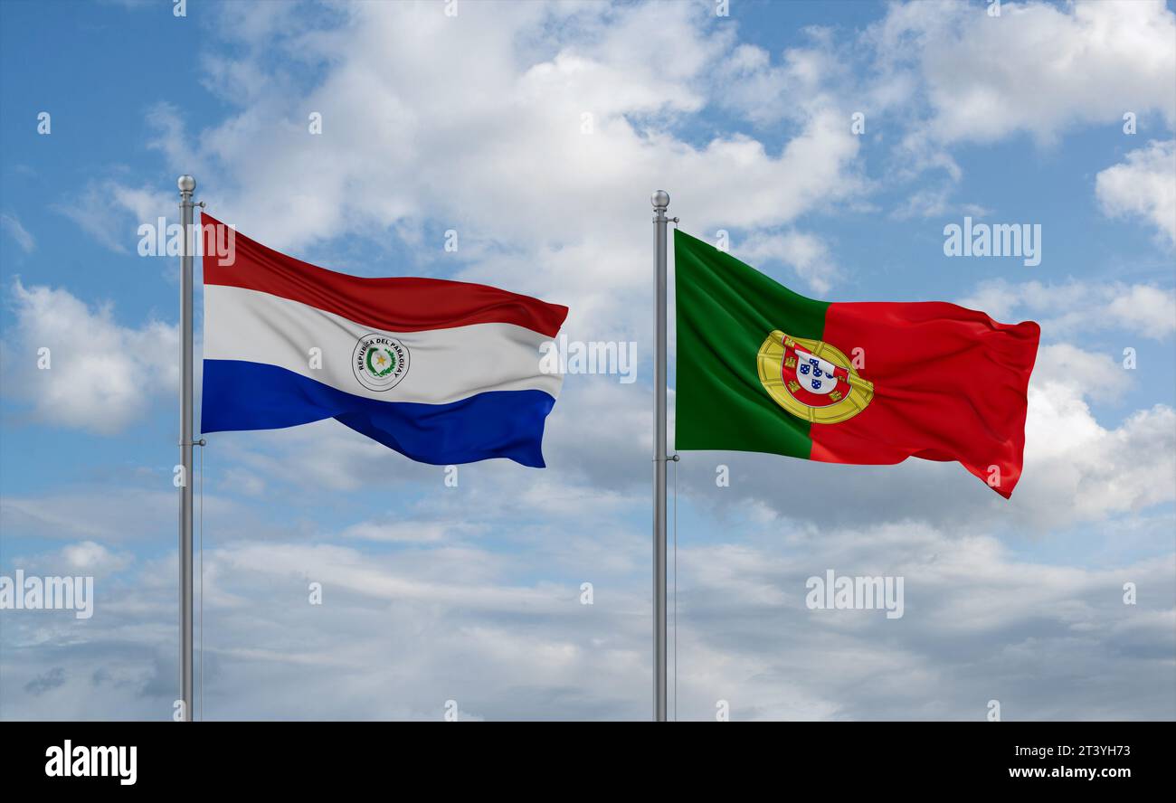 Portugal and Paraguay flags waving together in the wind on blue cloudy sky, two country ...