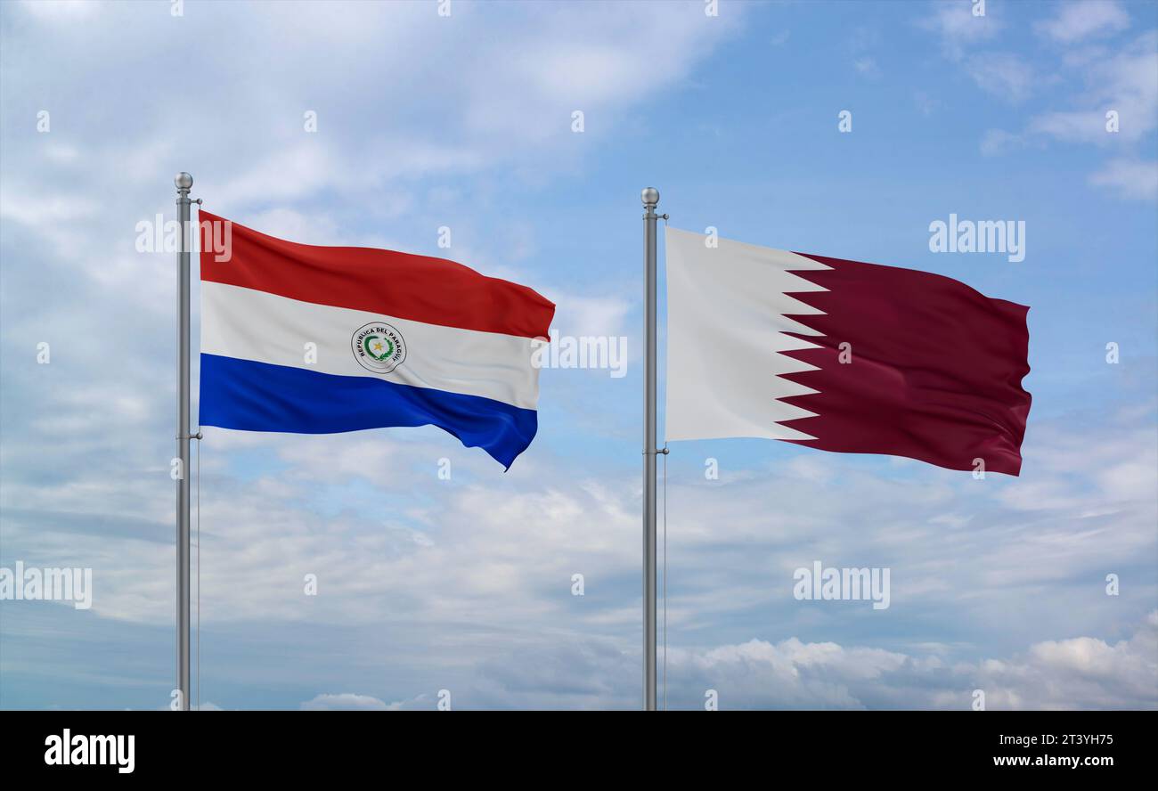 Qatar and Paraguay flags waving together in the wind on blue cloudy sky ...