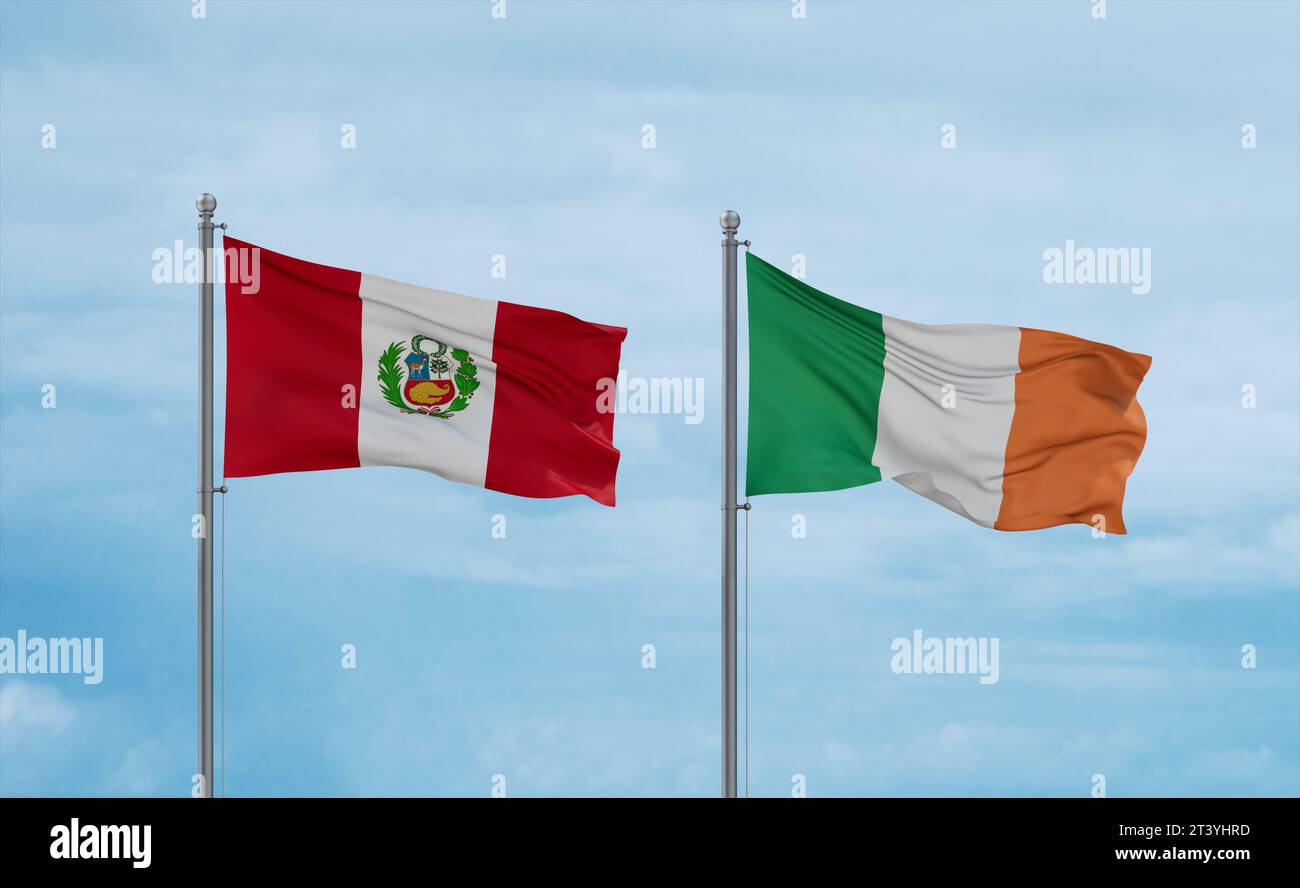 Ireland and Peru flags waving together in the wind on blue cloudy sky ...