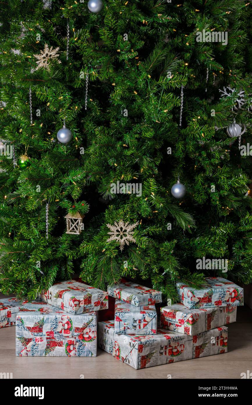 Presents wrapped and under a christmas tree hi-res stock photography ...