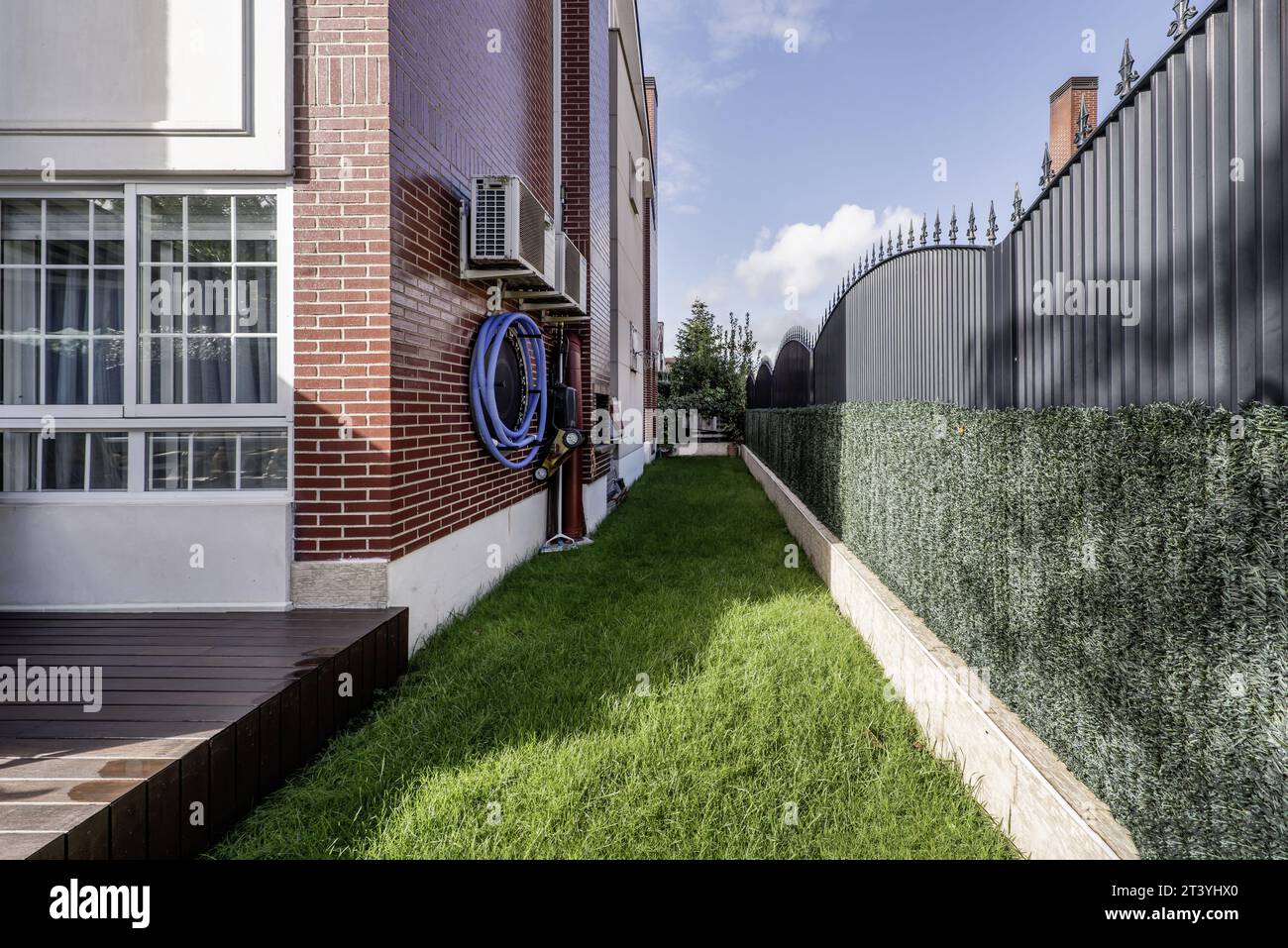 Small elongated plot of grass that surrounds the perimeter of a single ...