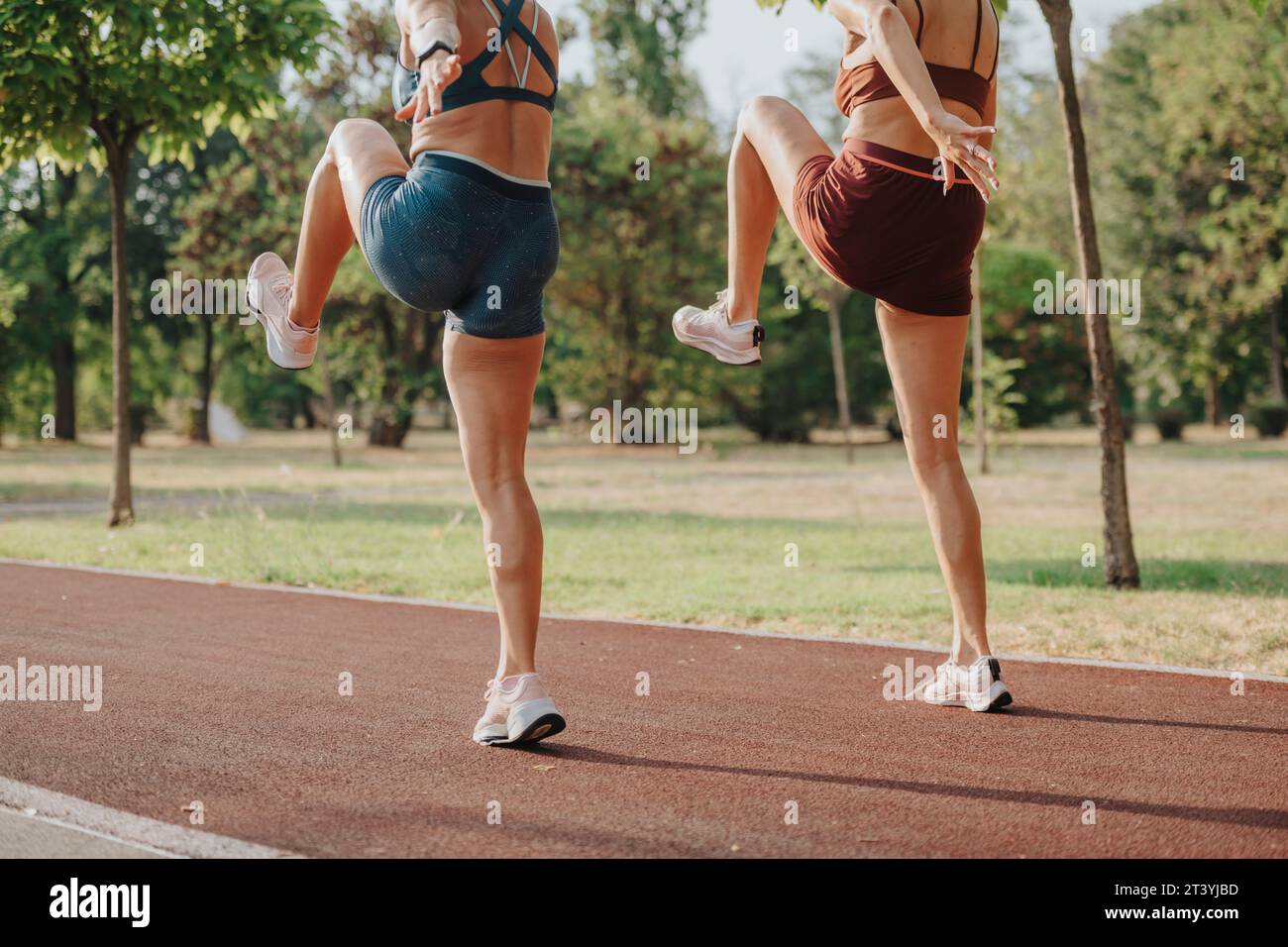 Gorgeous Female Athletes Jogging Outdoors in Green Park Stock Photo - Alamy