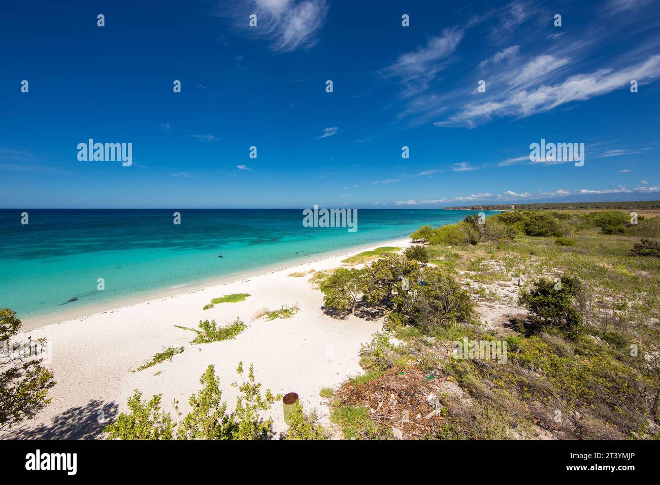 Top view of a wild deserted beach with white sand and clear water ...