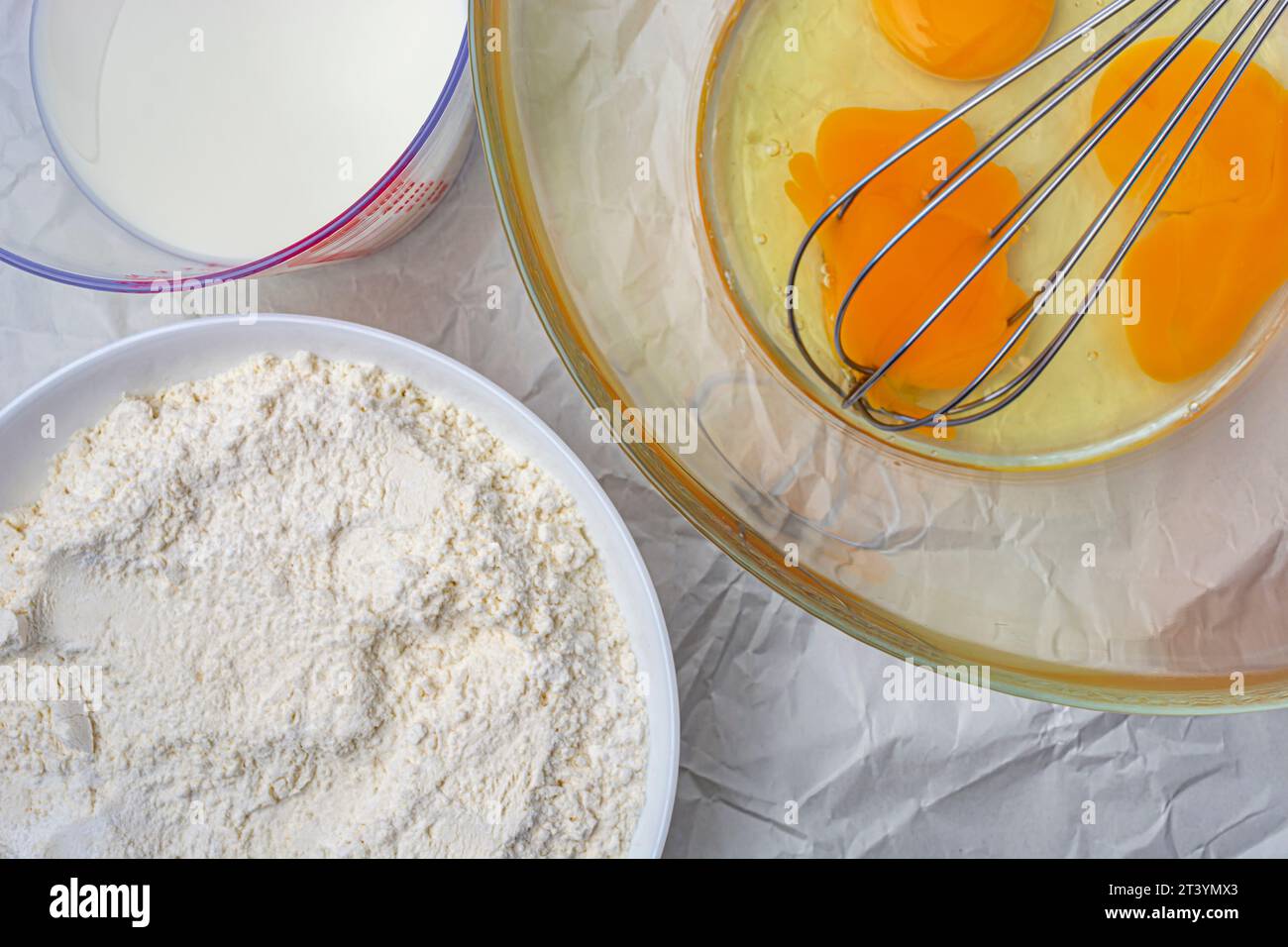 milk, eggs, flour vegetable oil and whisk Stock Photo - Alamy