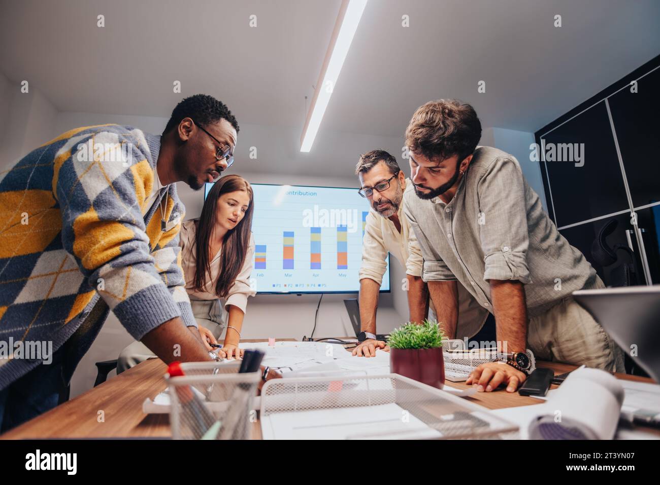 Multiracial Team of Architects and Engineers Collaborating on ...