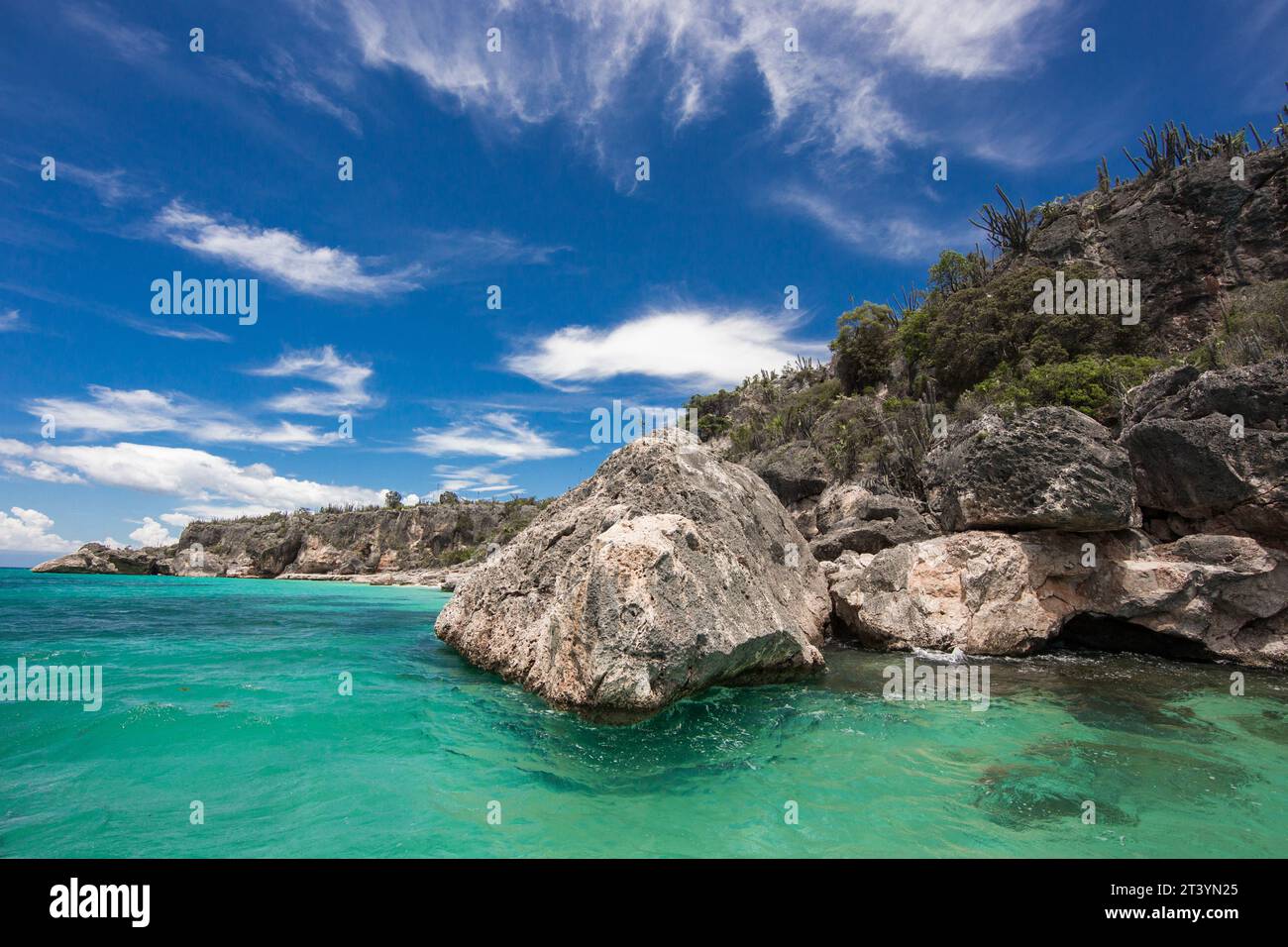 Rocky coast blue sky and azure water, caribbean sea. Dominican Republic ...
