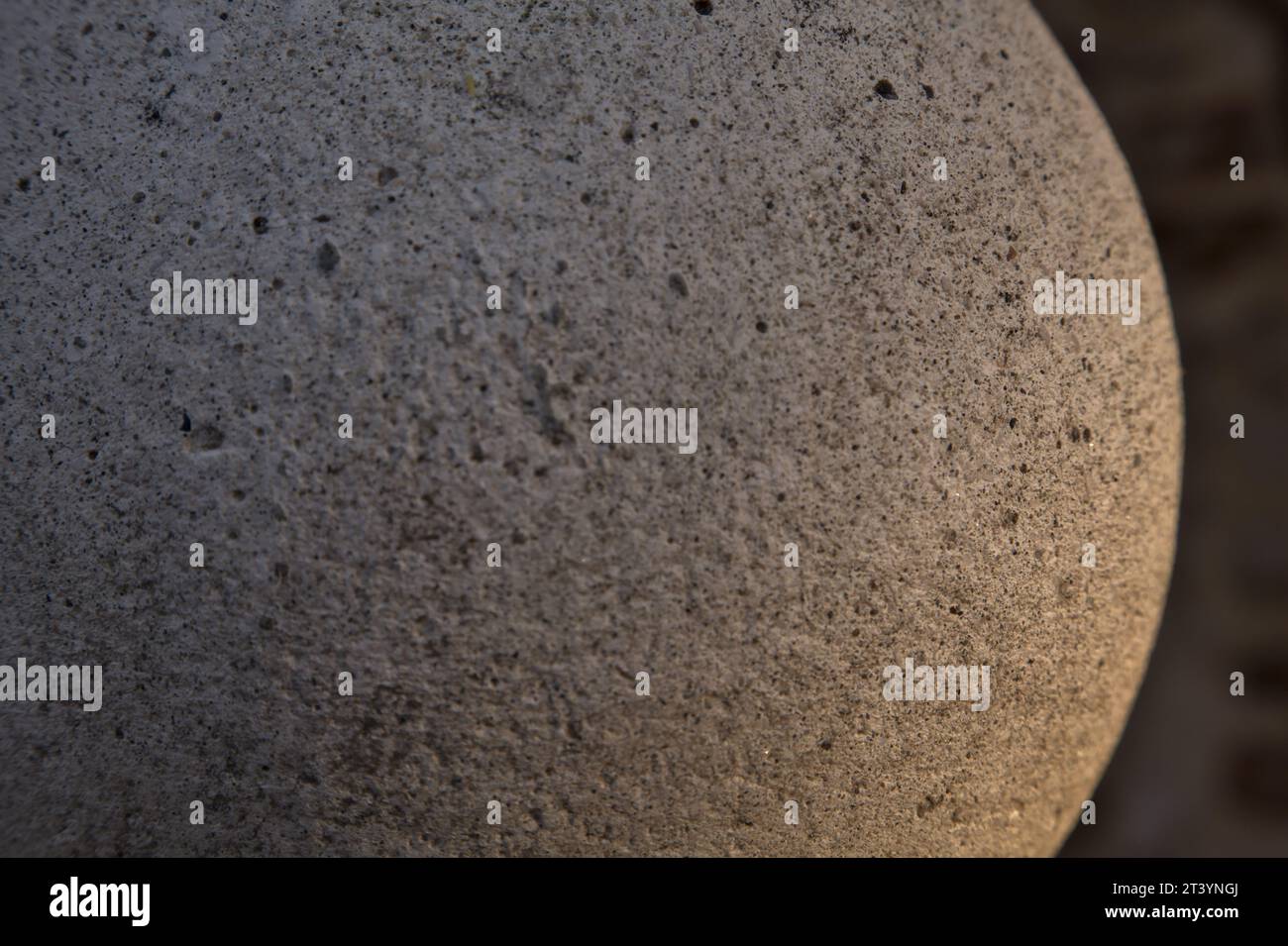 Stone sphere lit by the sun Stock Photo - Alamy