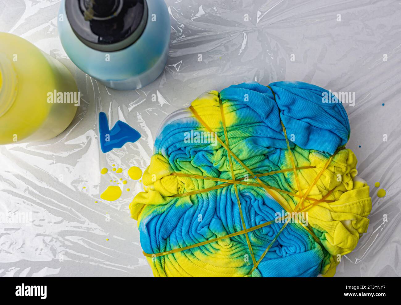 T-shirt yellow and blue paint in tai-dai technique Stock Photo - Alamy