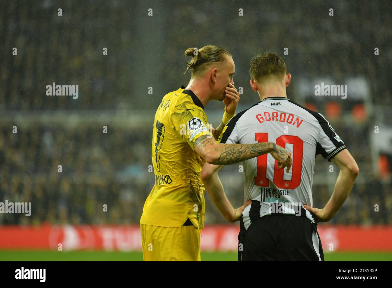 NEWCASTLE upon Tyne, UK. , . Anthony Gordon, Marius Wolf in action ...