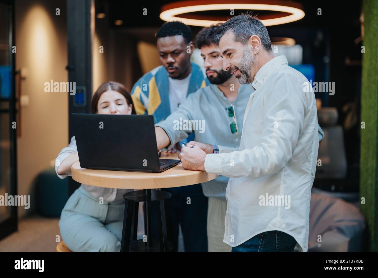 Collaboration for Better Efficiency: Multiracial Businesspeople Analyze ...