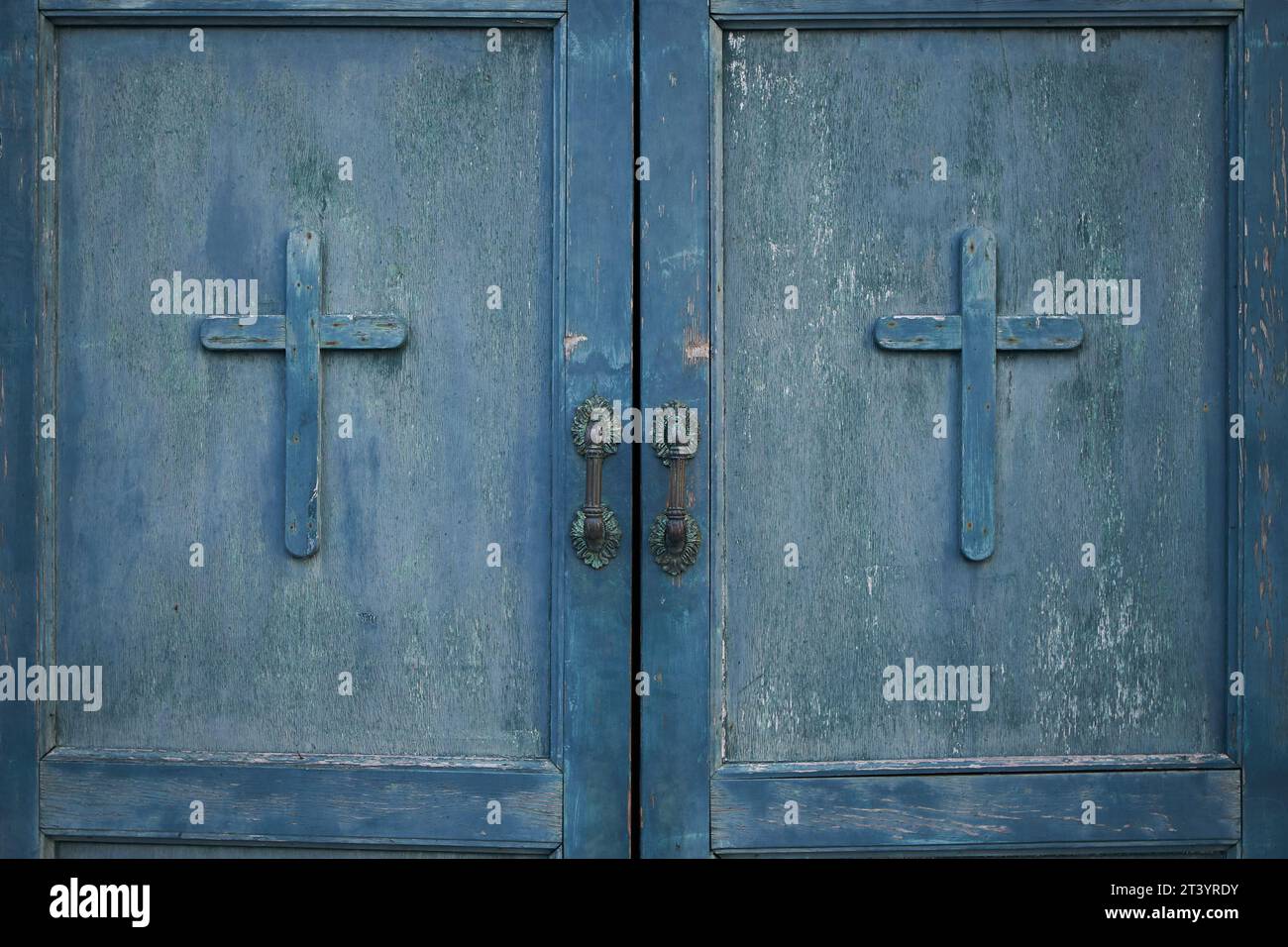 Old wooden door with christian cross. Catholic church door decorated ...