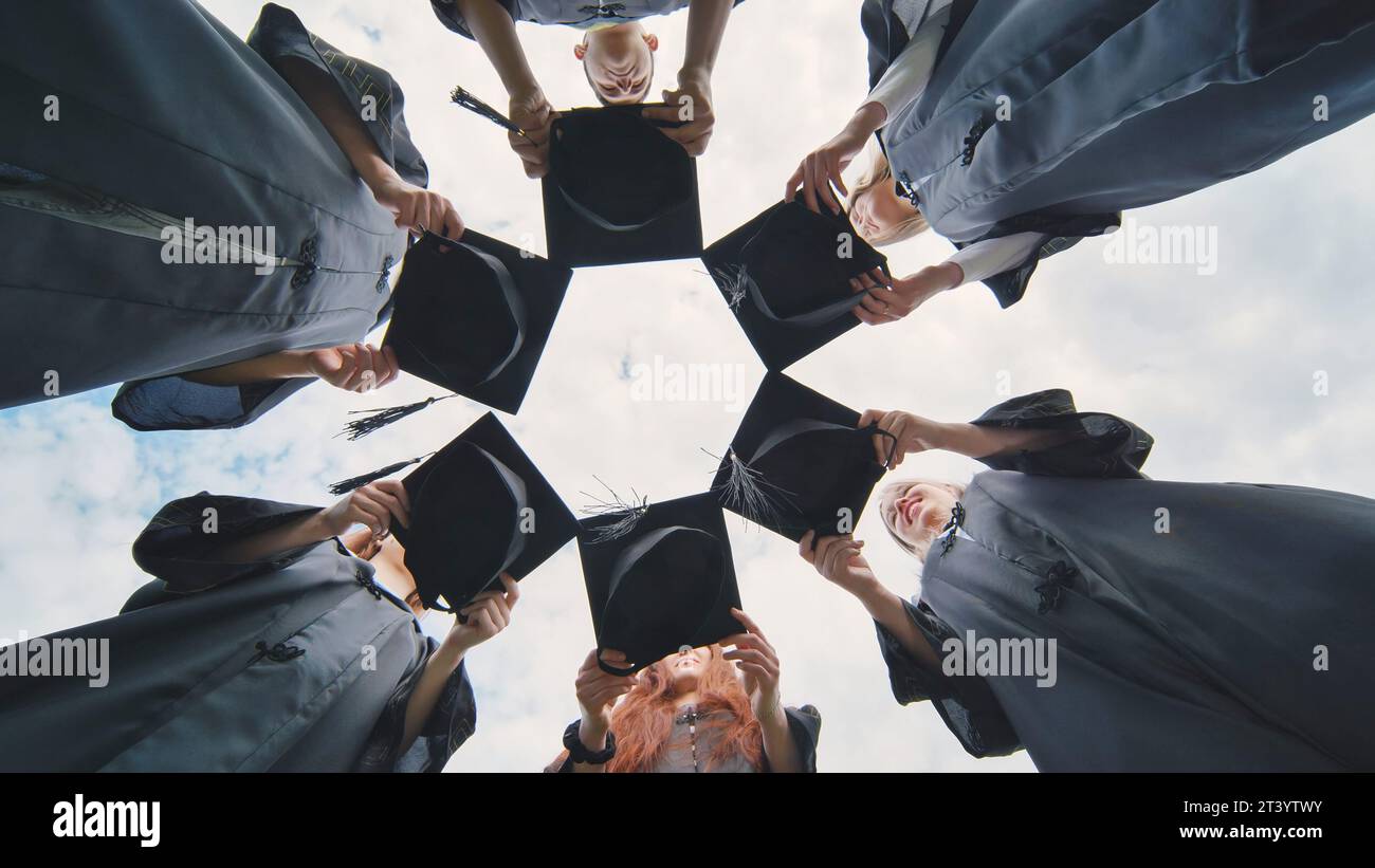 Graduates in robes caps hi-res stock photography and images - Alamy