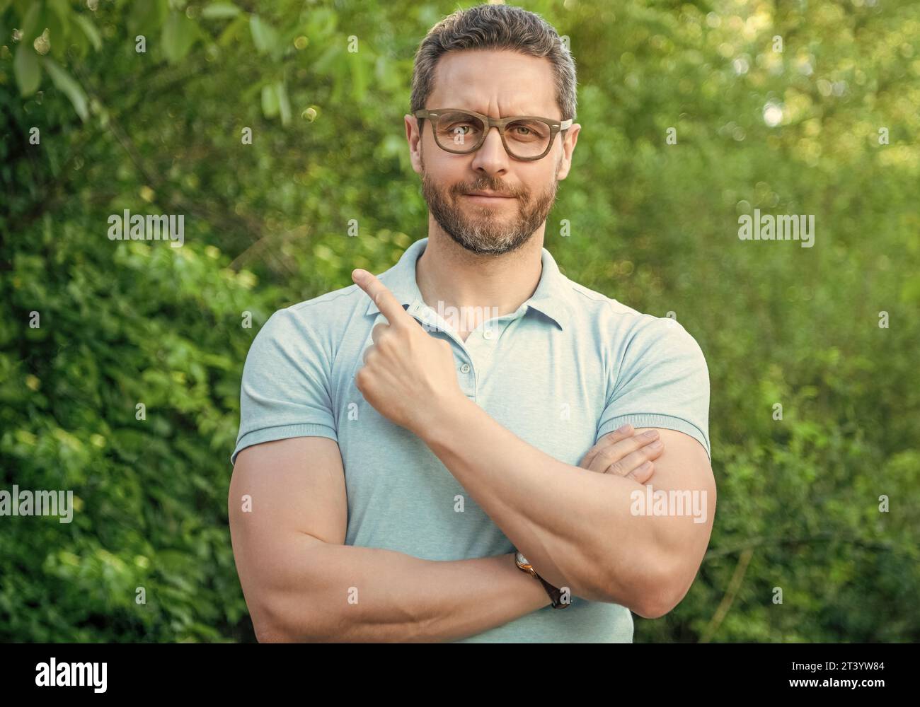 man look in glasses outdoor, point finger. man look in glasses for ...