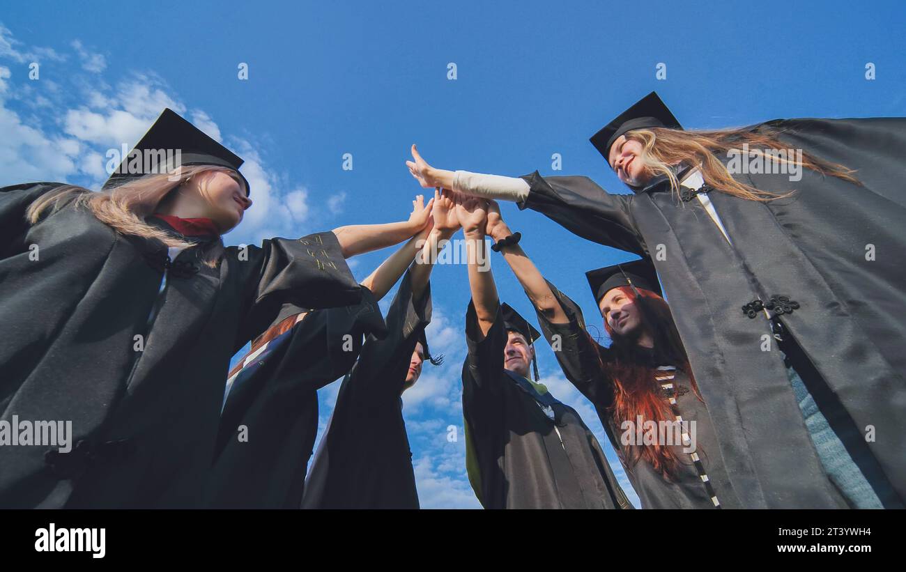 Three graduates celebrating hi-res stock photography and images - Alamy