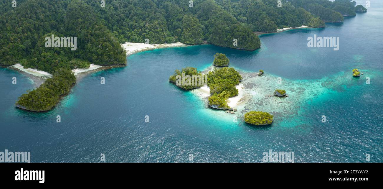 Scenic limestone islands, covered by tropical vegetation, are fringed ...