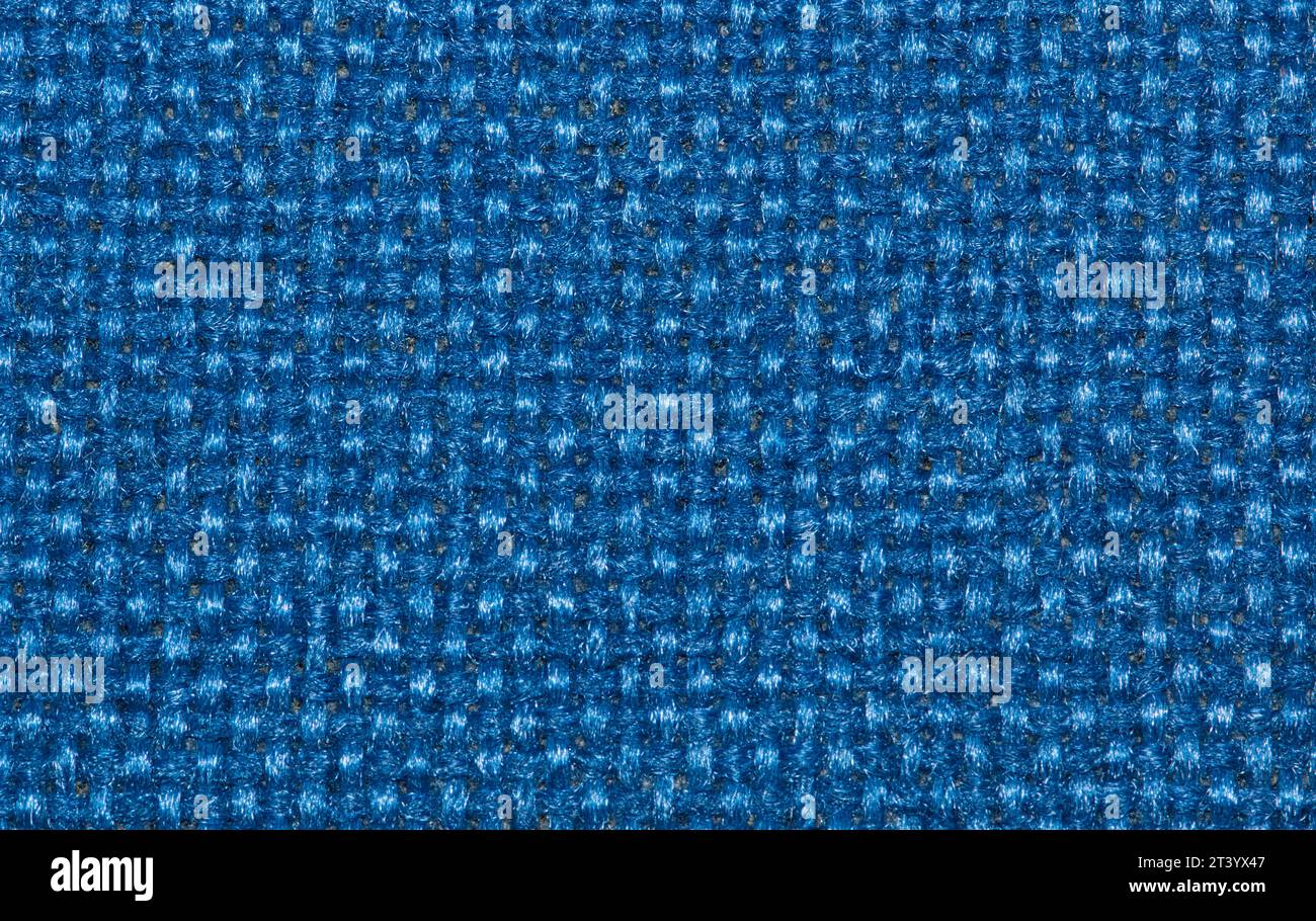 Solid royal blue color swatch of woven fabric on upholstery made from ...