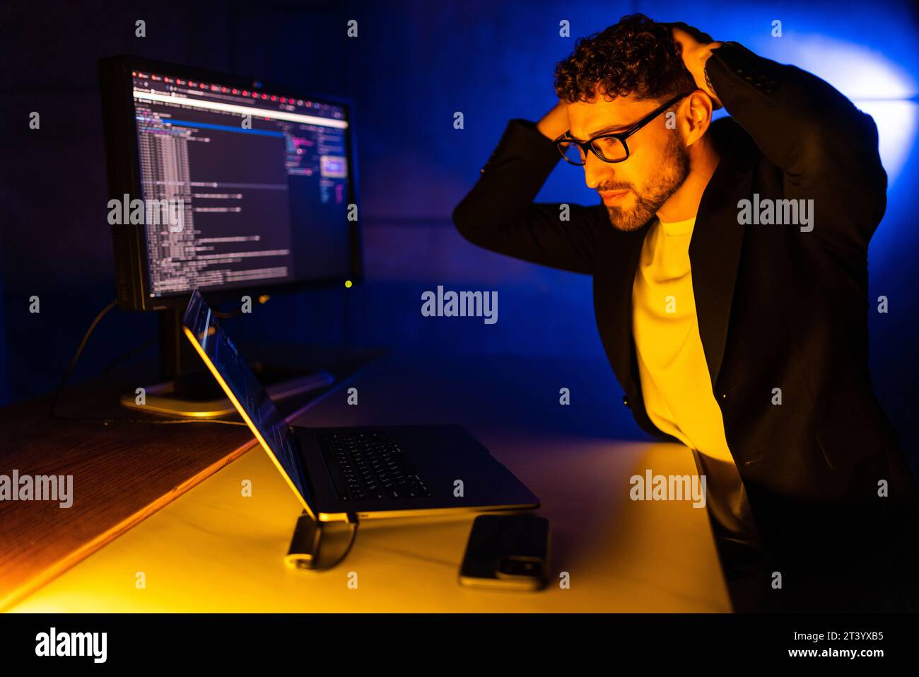 Photo of serious professional programmer look camera improving ...